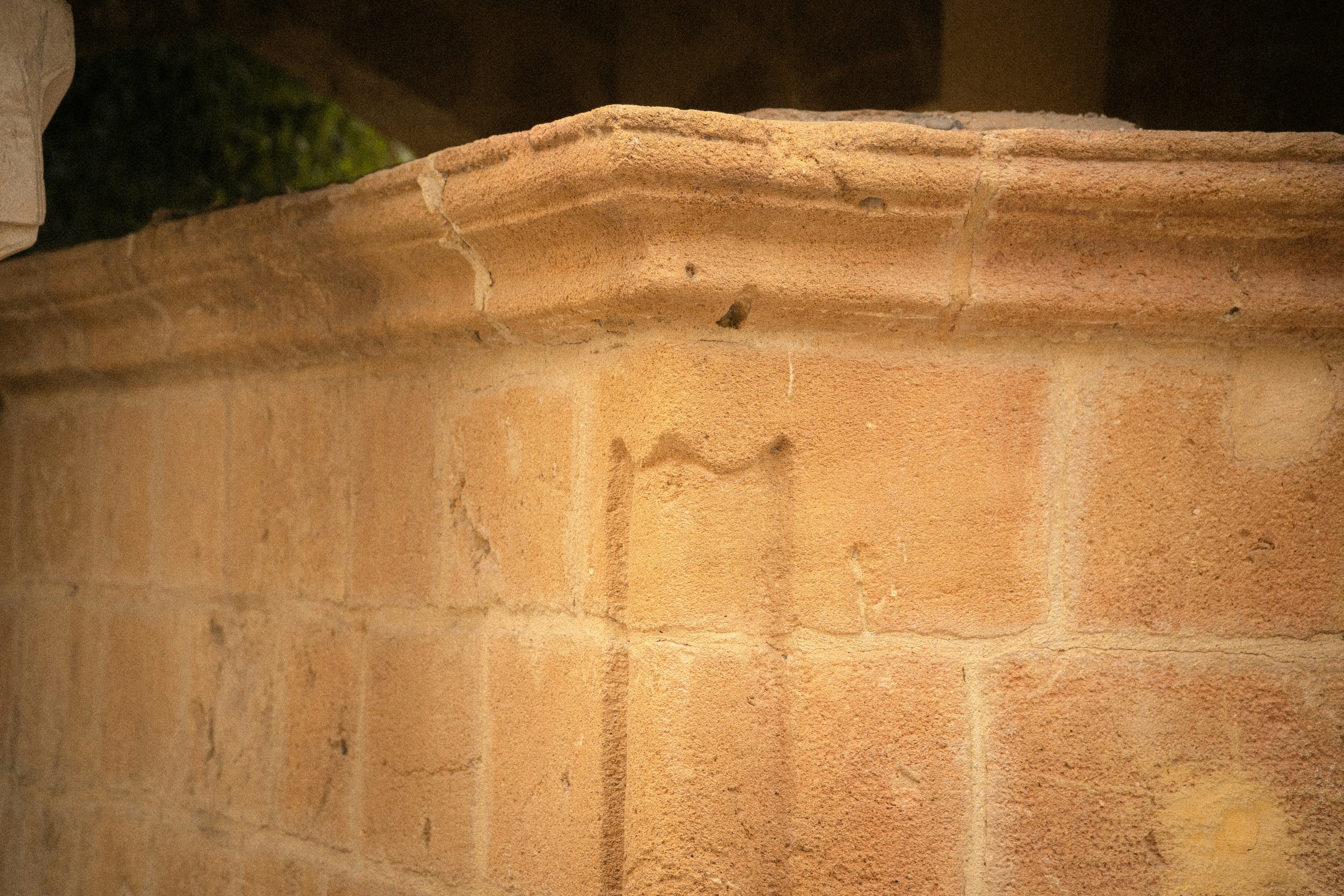 Stone Edge at Dusk: Weathered Top of a Terrace Wall