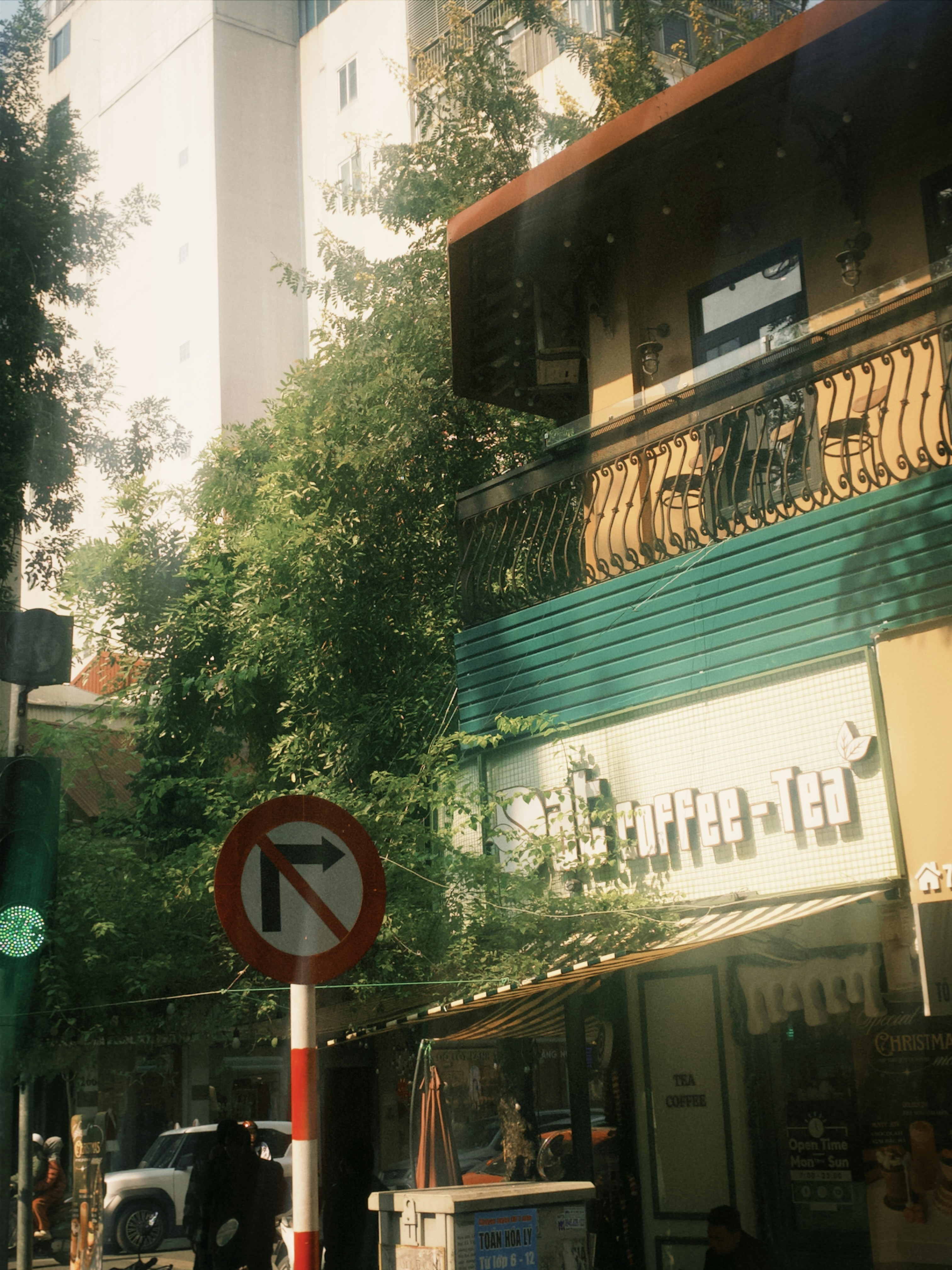 Street Corner Café Under Café Balcony