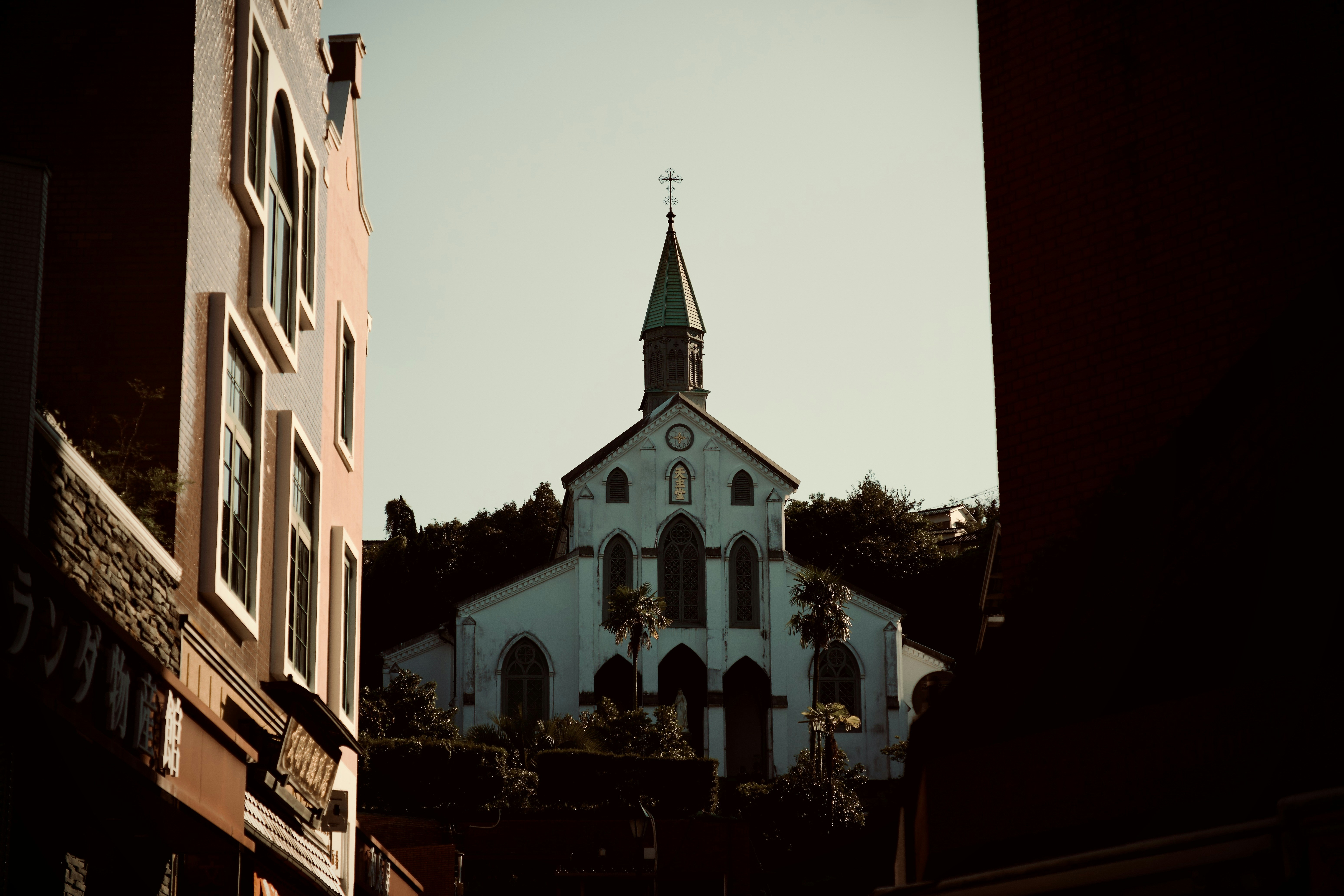 Church in a Narrow Canyon of Buildings Under Soft Light