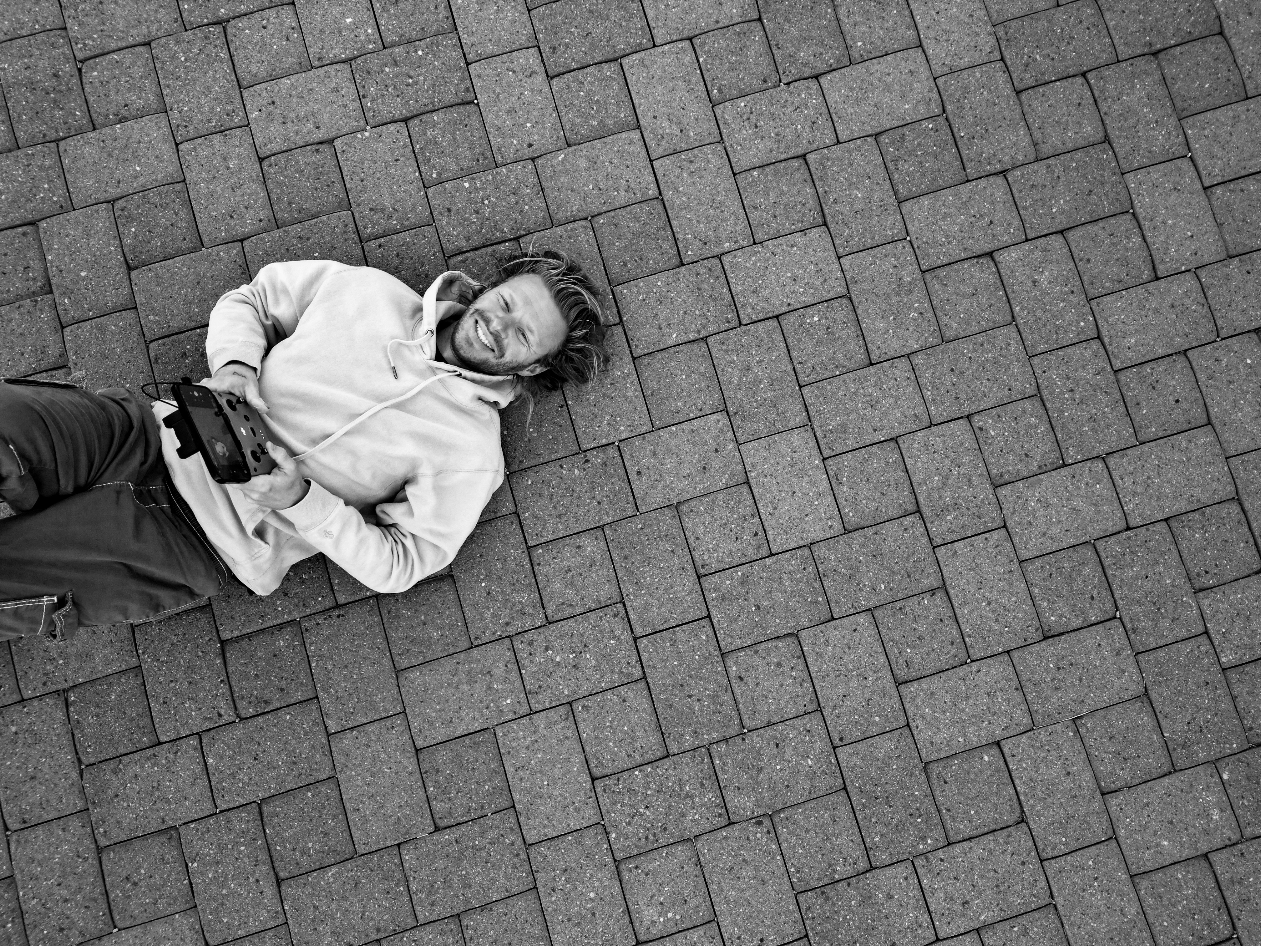 Lying on Cobblestones: A Quiet Moment Captured