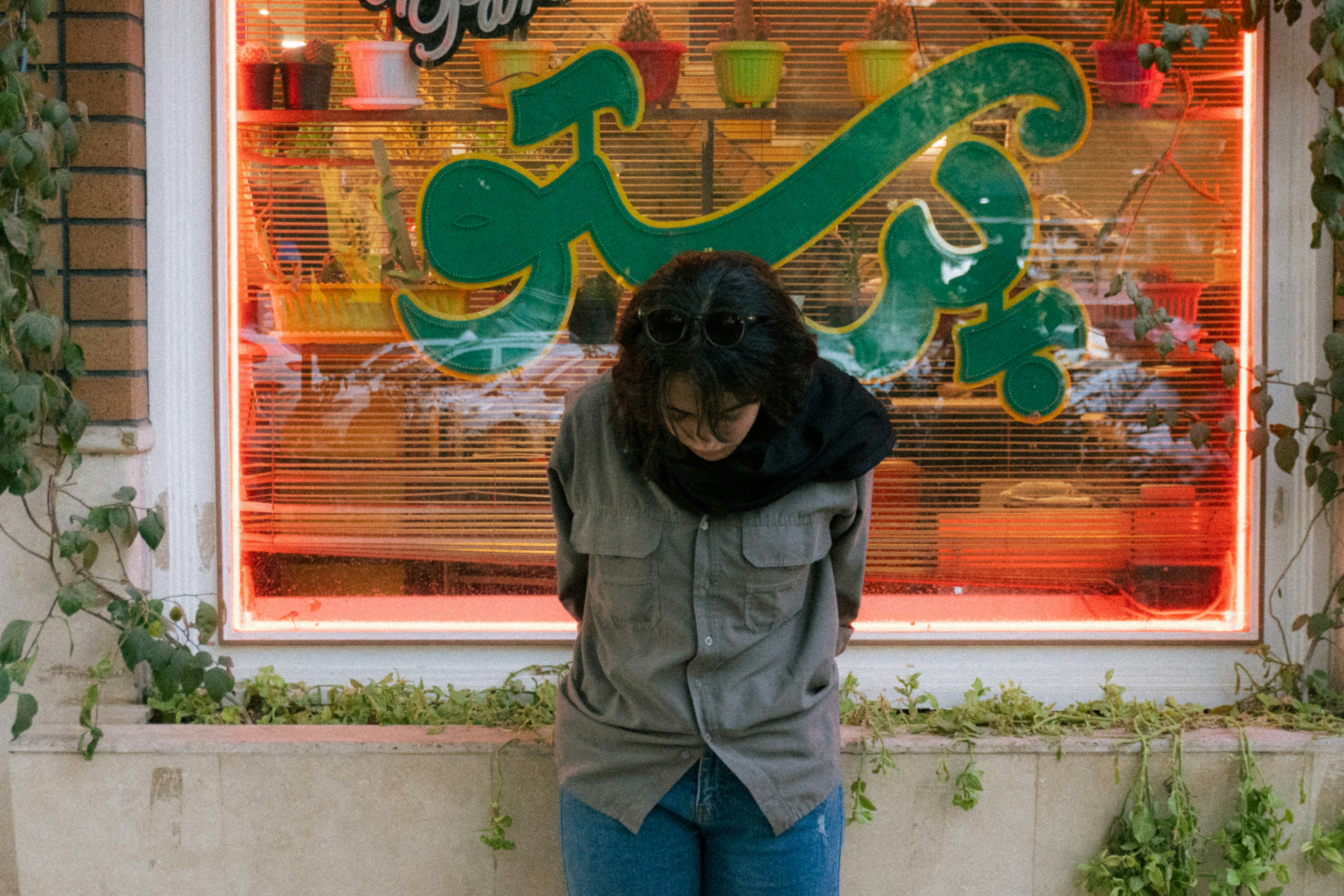 Neckline of Denim and Neon: A Quiet Portrait in Front of Neon Green Flourish