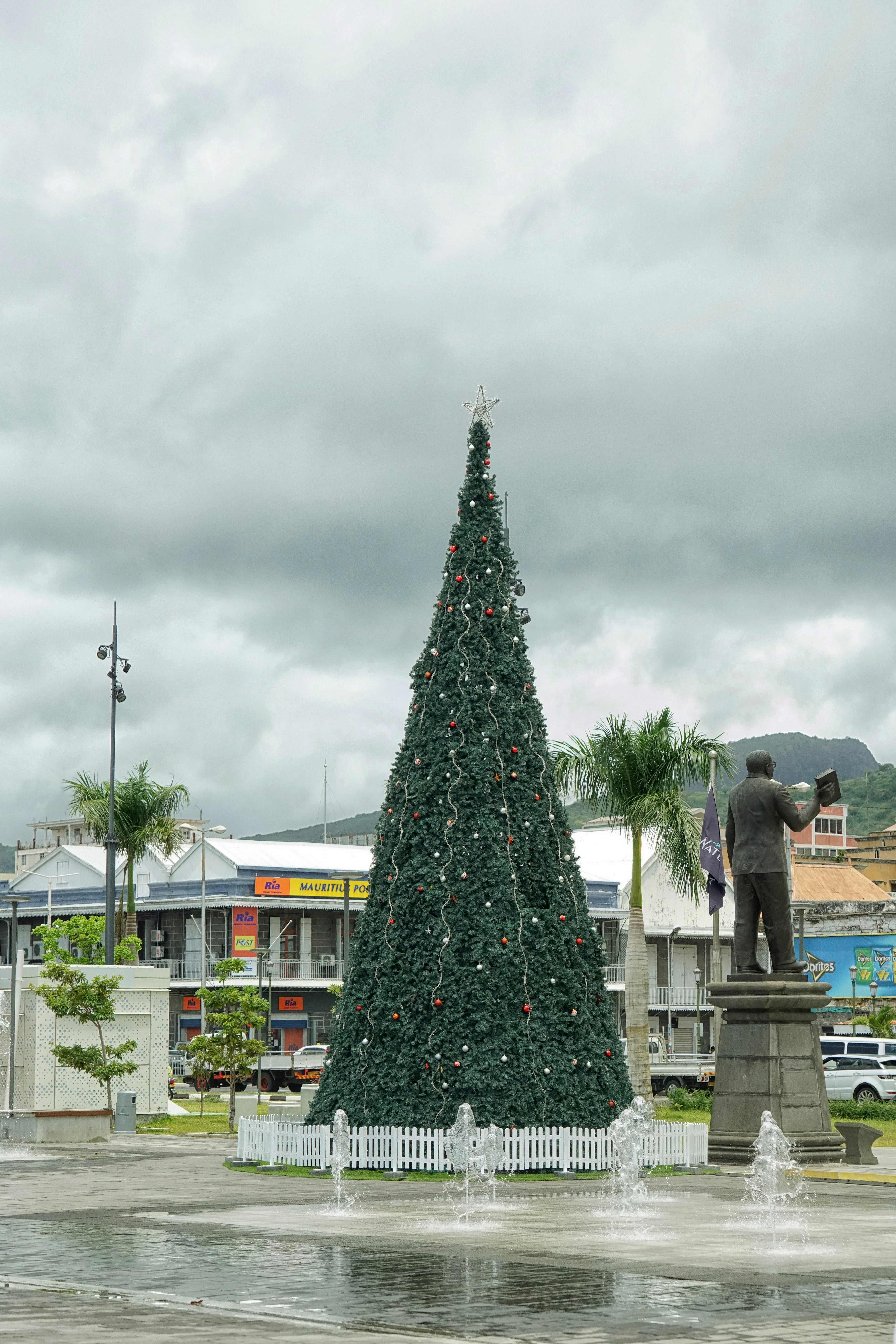 A decorated christmas tree in a public square.