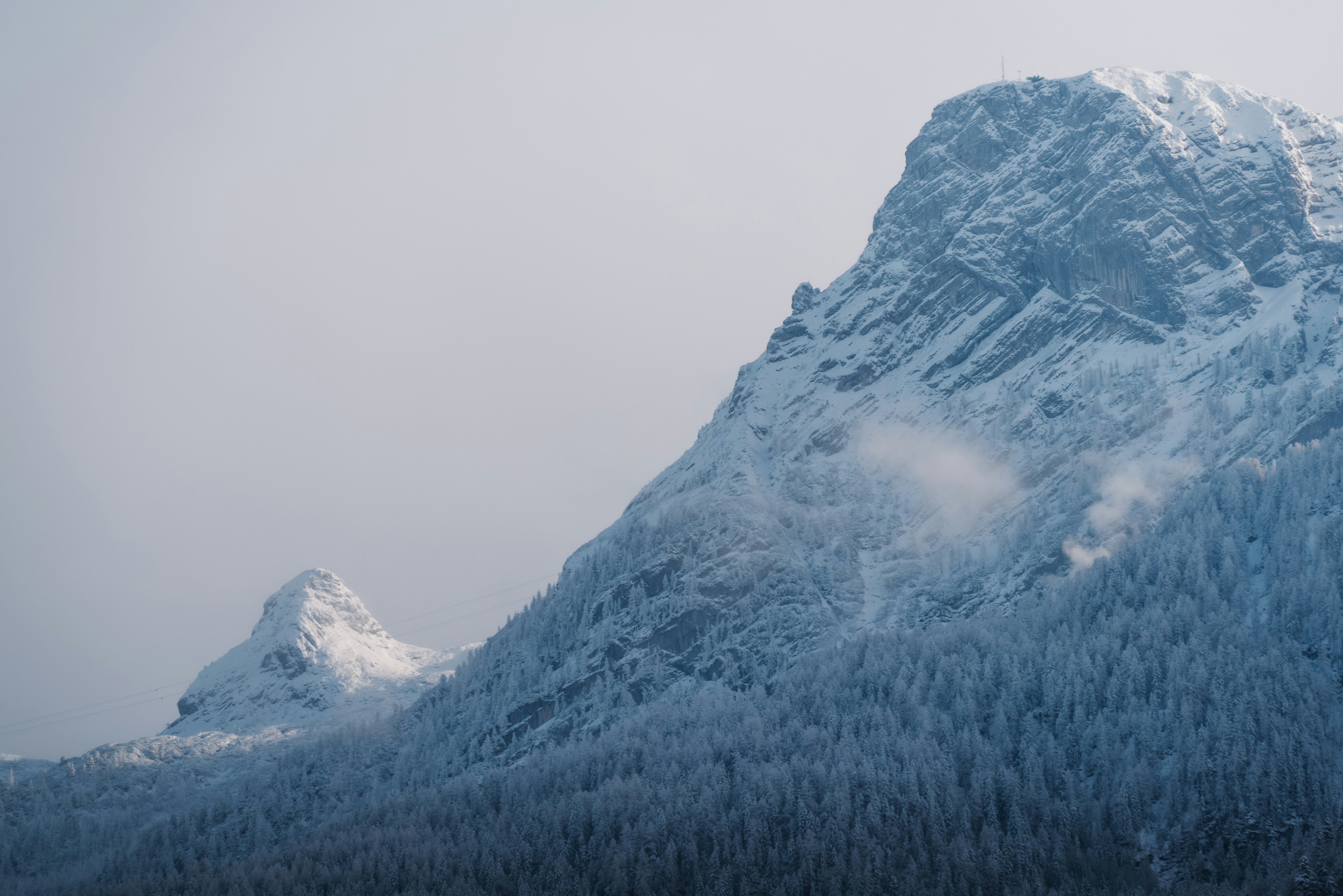 Majestic Winter Mountain Under Pale Sky