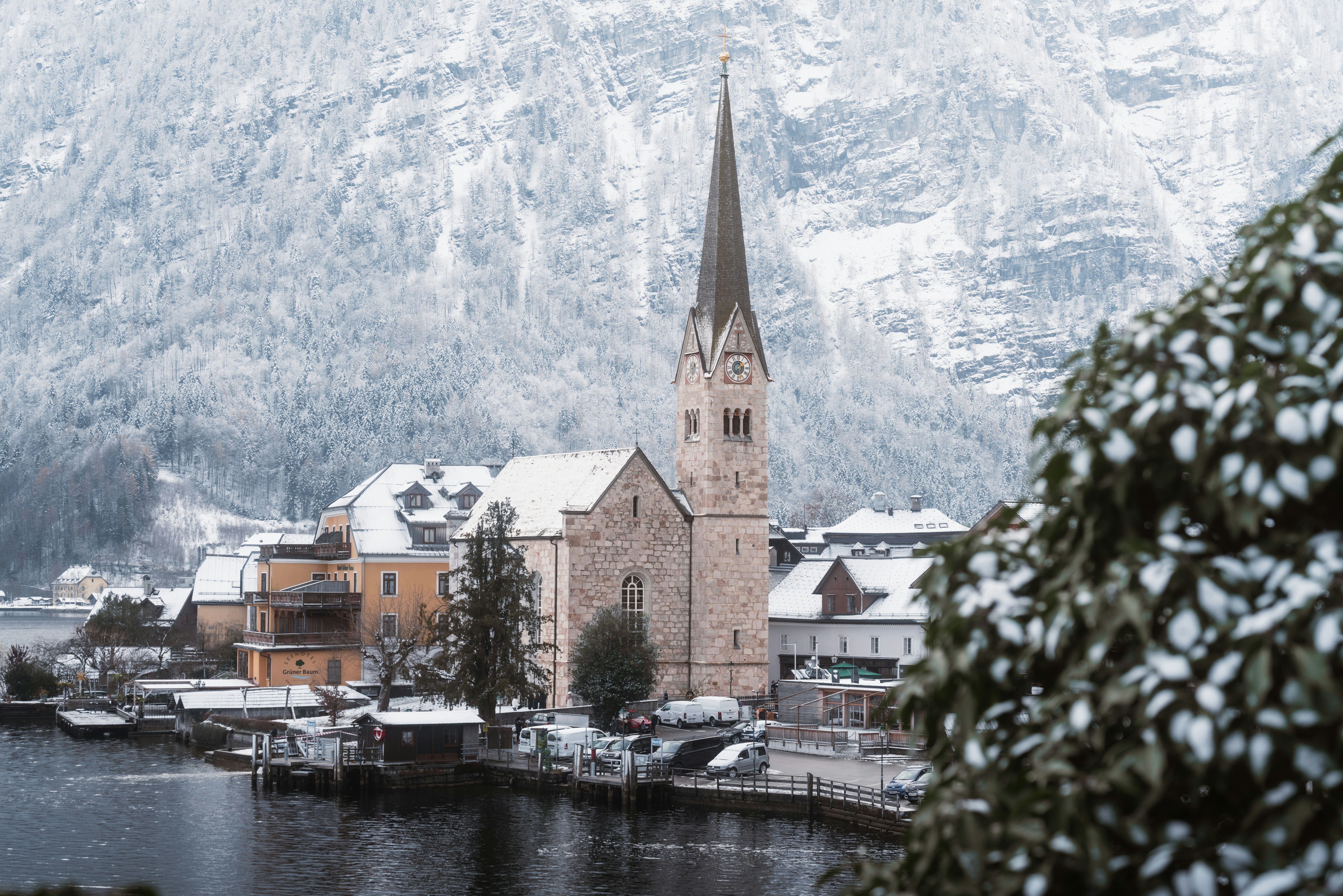 Snowbound Village by the Lake: A Stone Church at Dusk
