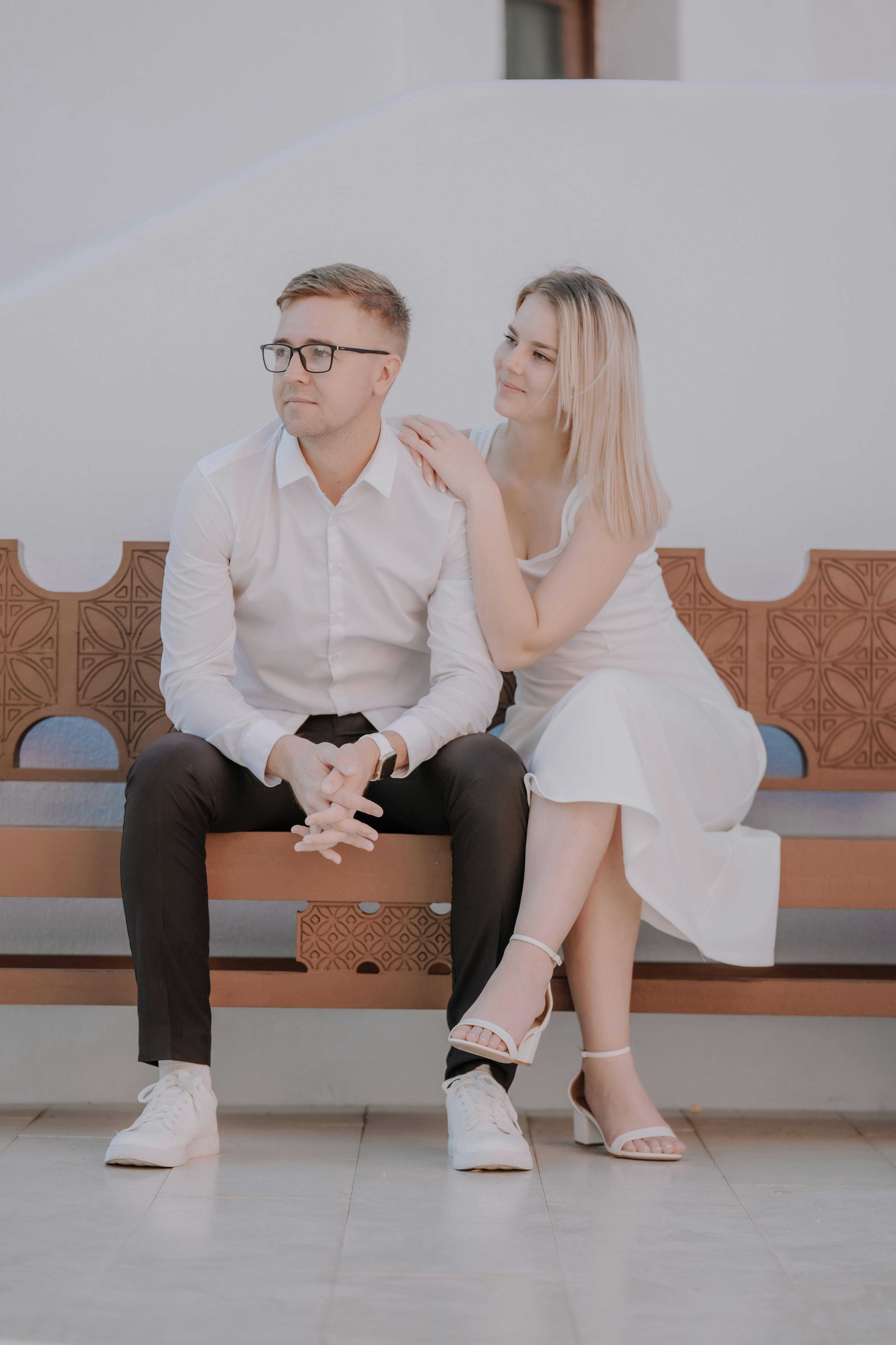 Quiet Companionship on a White-Washed Bench