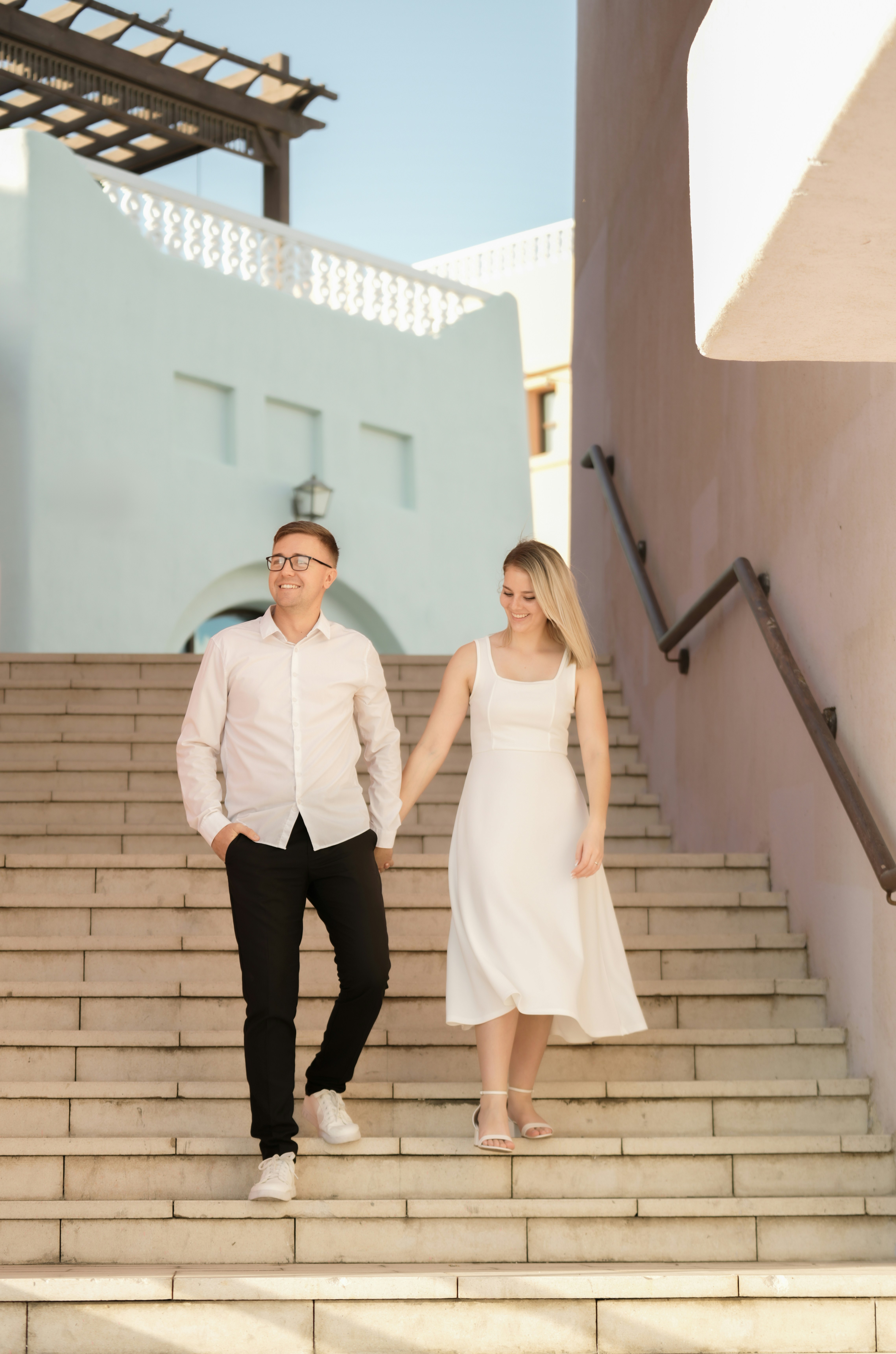 Staircase Stroll: A Quiet Moment in White and Stone