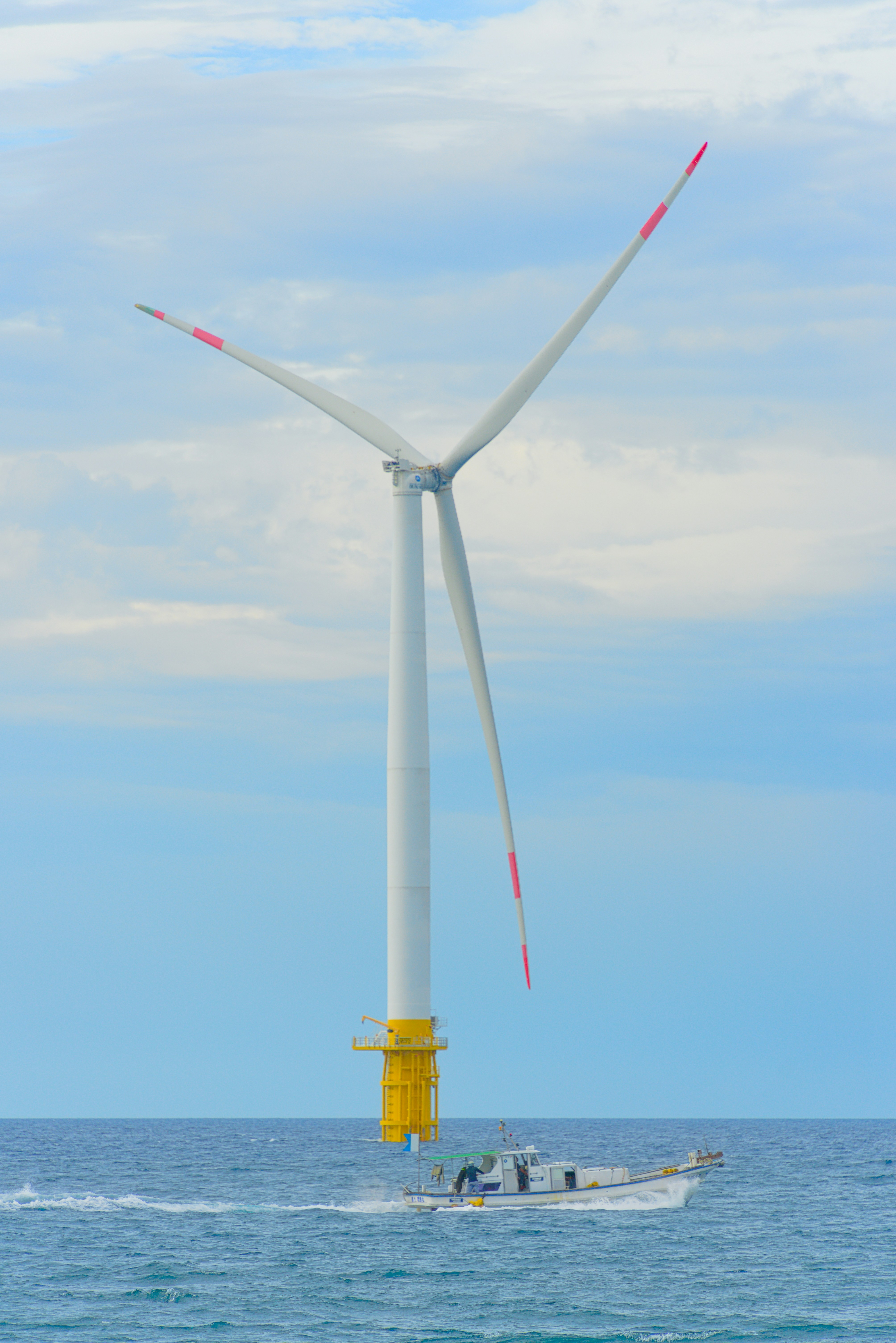 Wind Turbine Off Shore: A Lone Giant Above a Calm Sea
