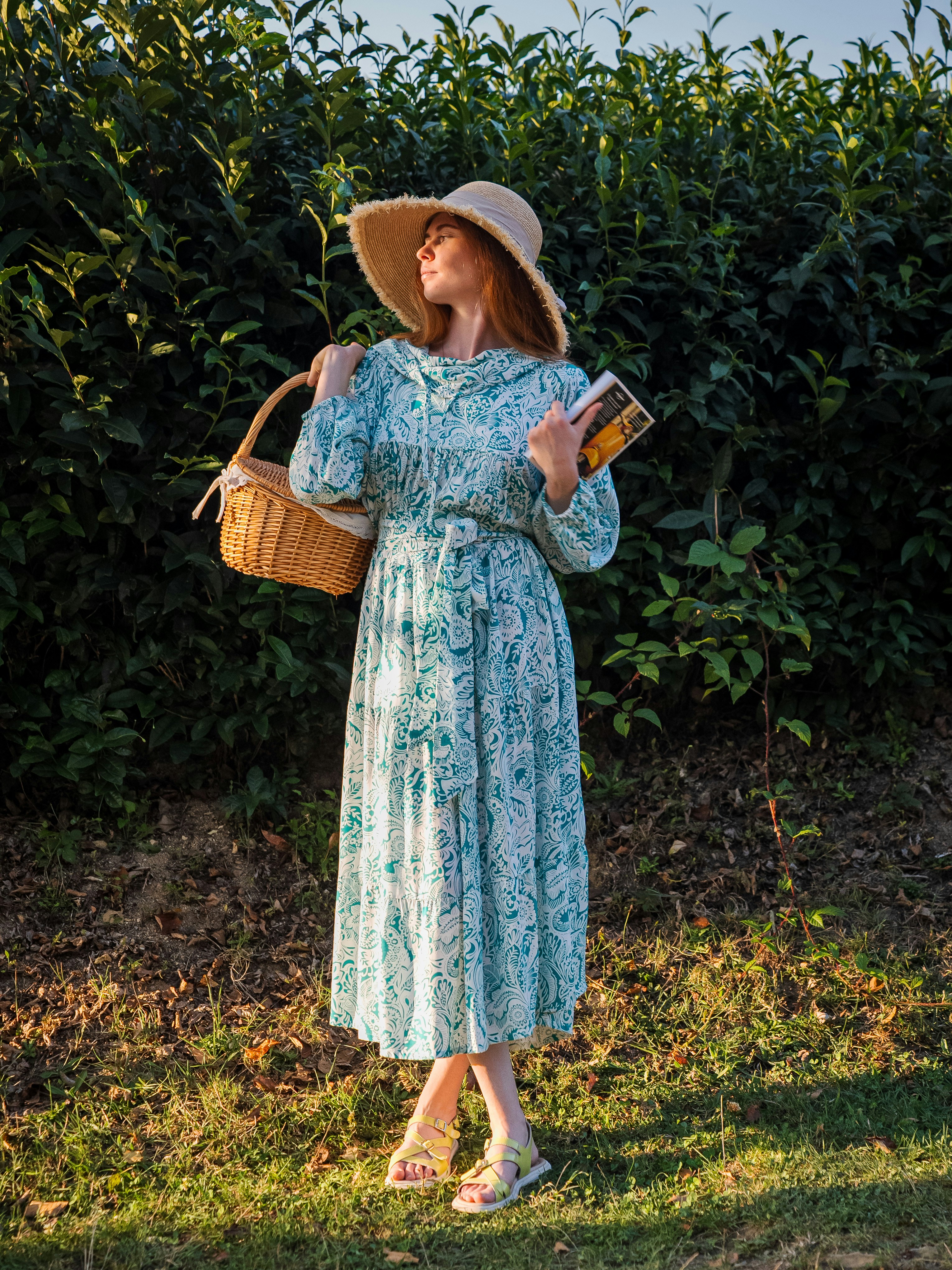 Sunlit Straw Hat in a Meadow of Green