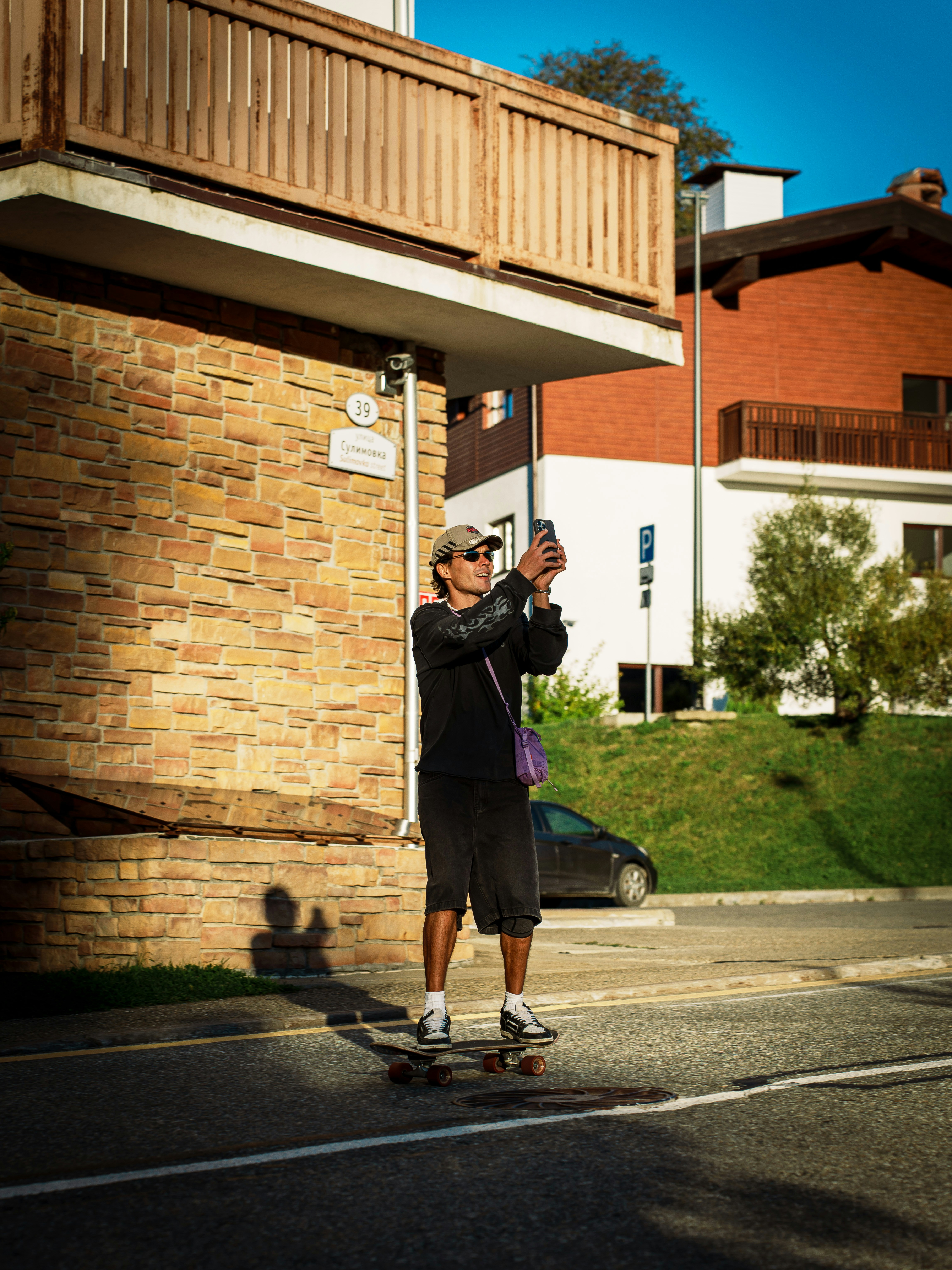 Skateboarder Capturing the Signal: A Moment on the Street