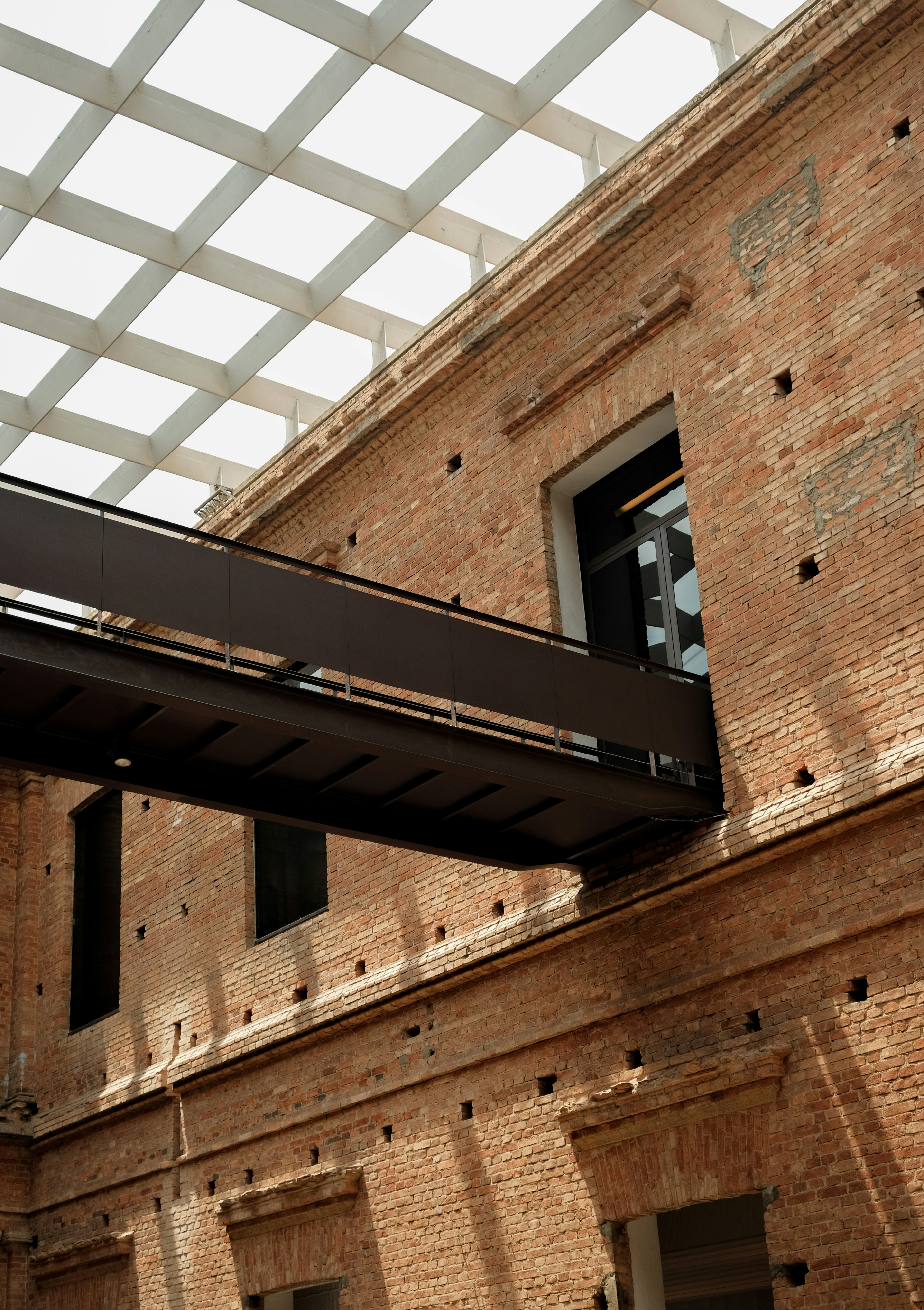 Brick and Beam: An Industrial Atrium Under Glass