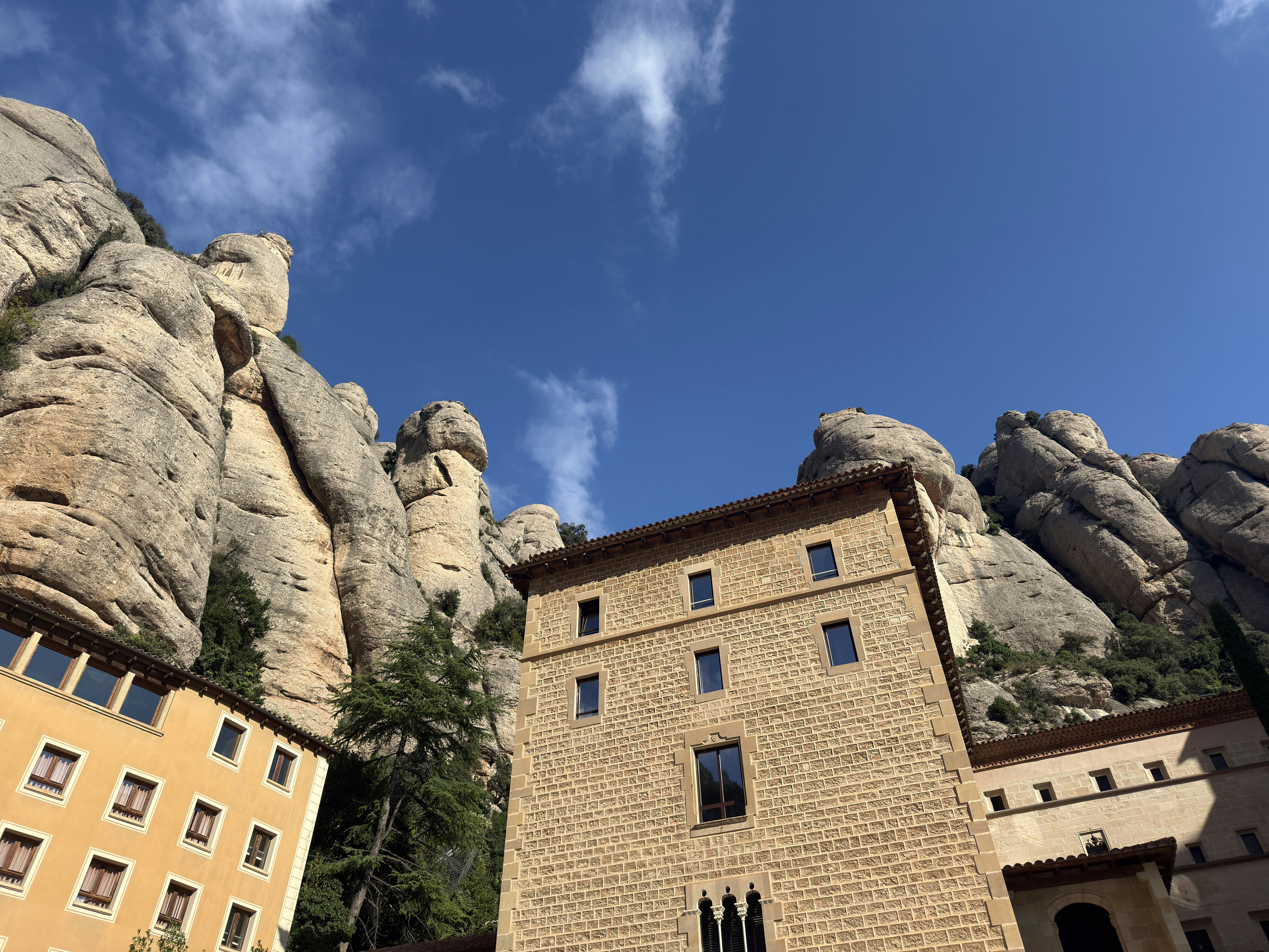 Stone Monoliths Overlooked by A Sunny Alpine Village