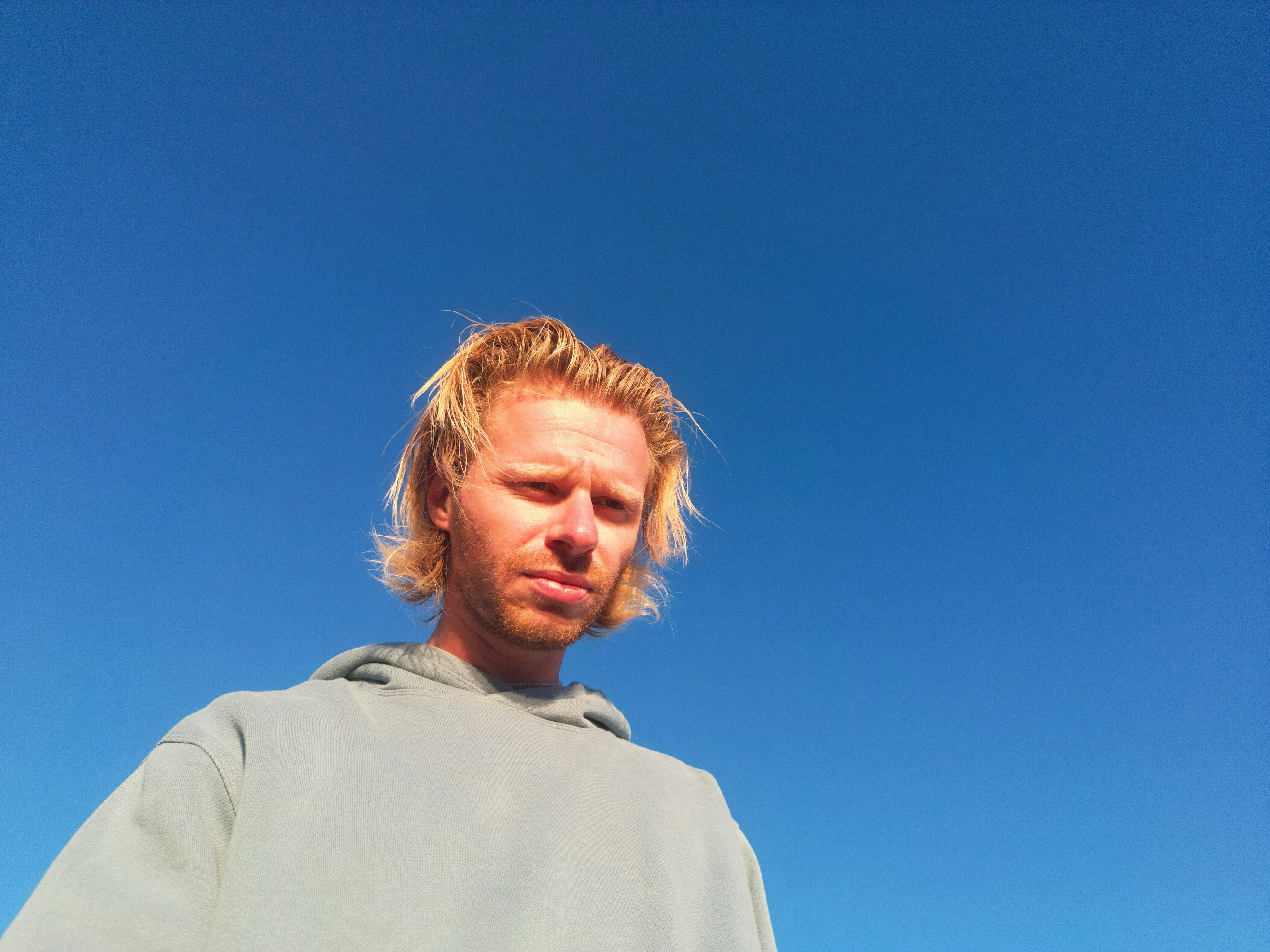 Sunlit Shoulders: A Portrait Under a Patch of Blue
