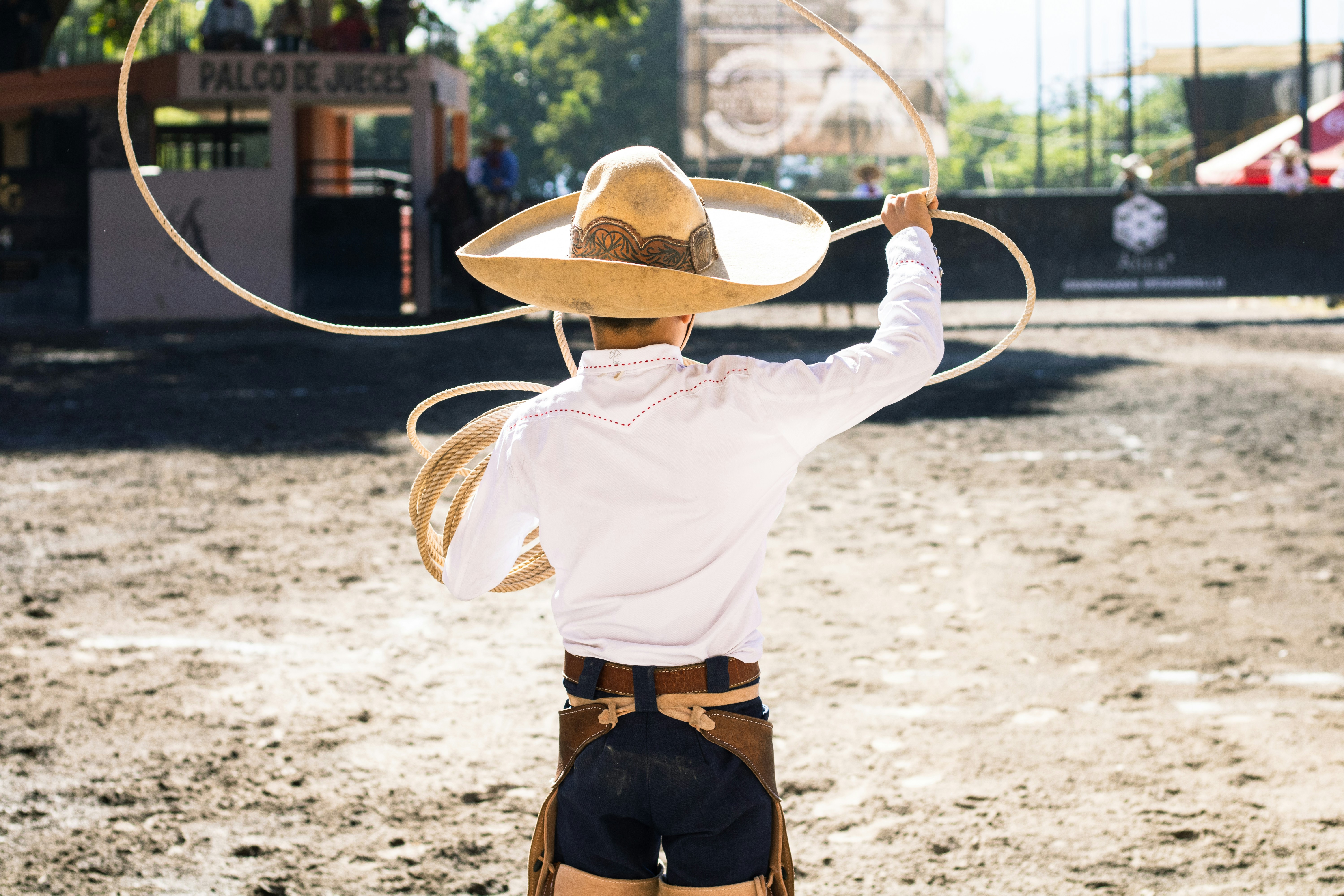 Charro with lasso in a dusty arena photo – Free Performance Image on ...