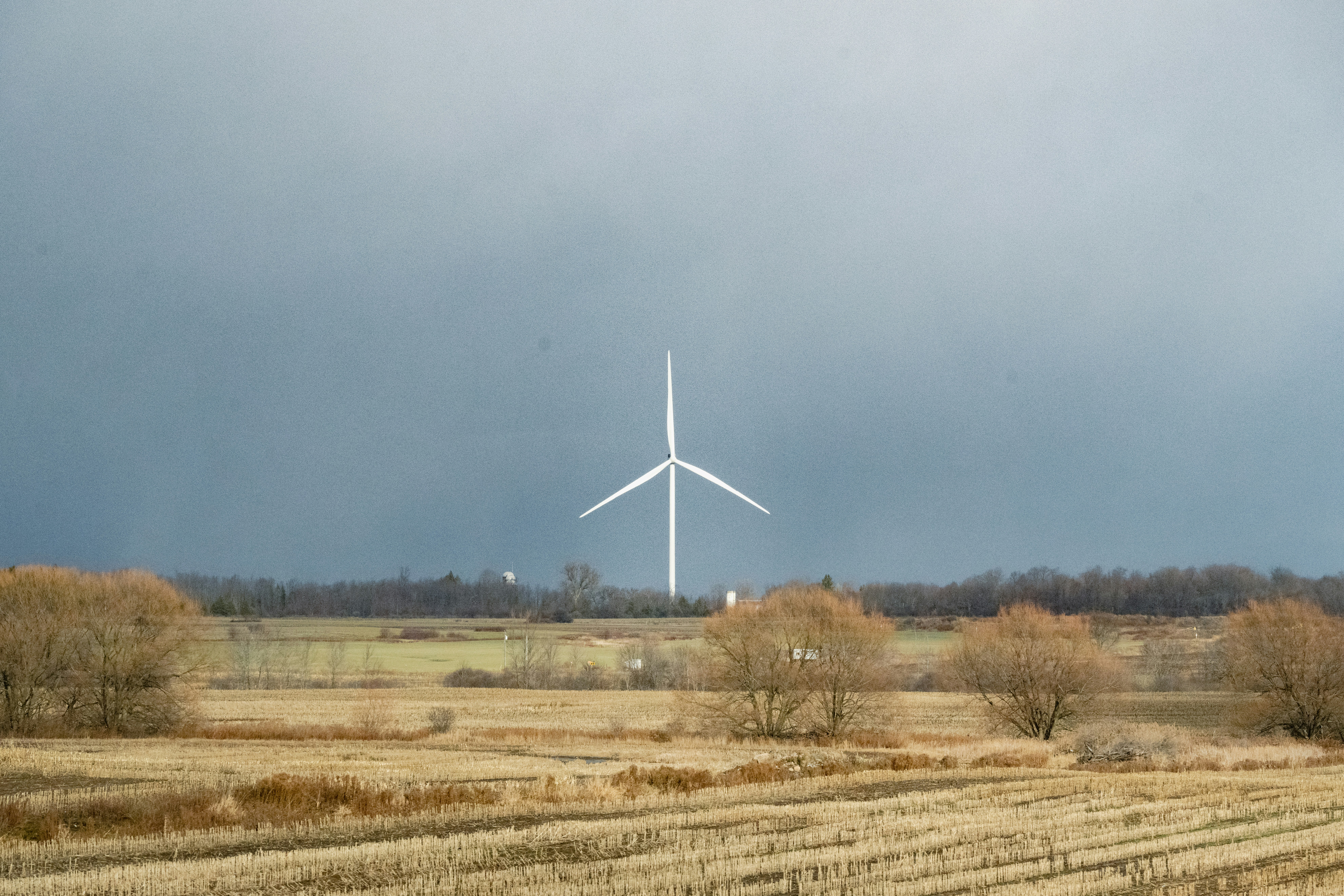 Wind Farm Horizon: A Lone Turbine Standing Over Prairie