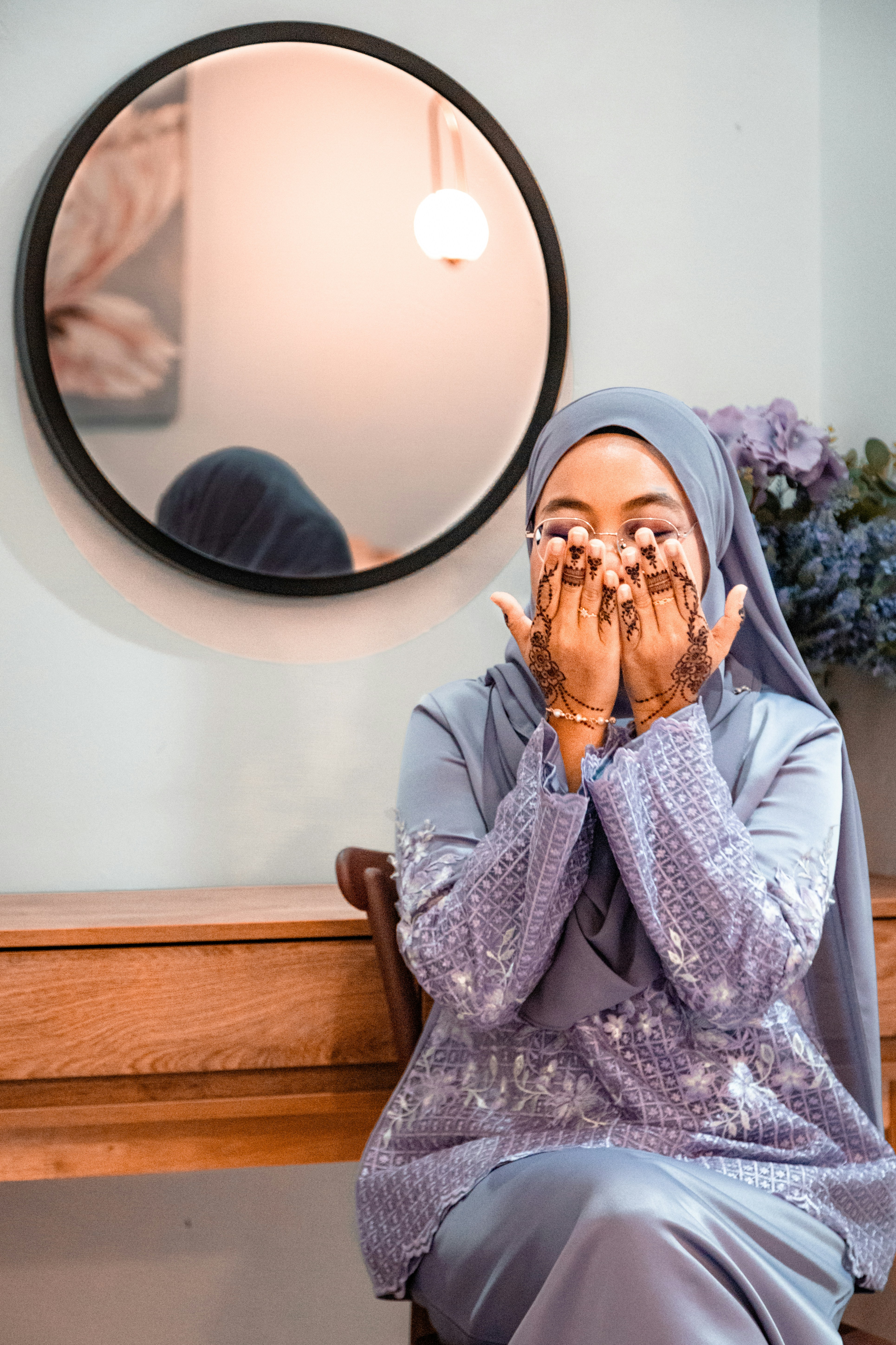 Veiled Joy: A Moment of Quiet Laughter in Soft Portrait Light
