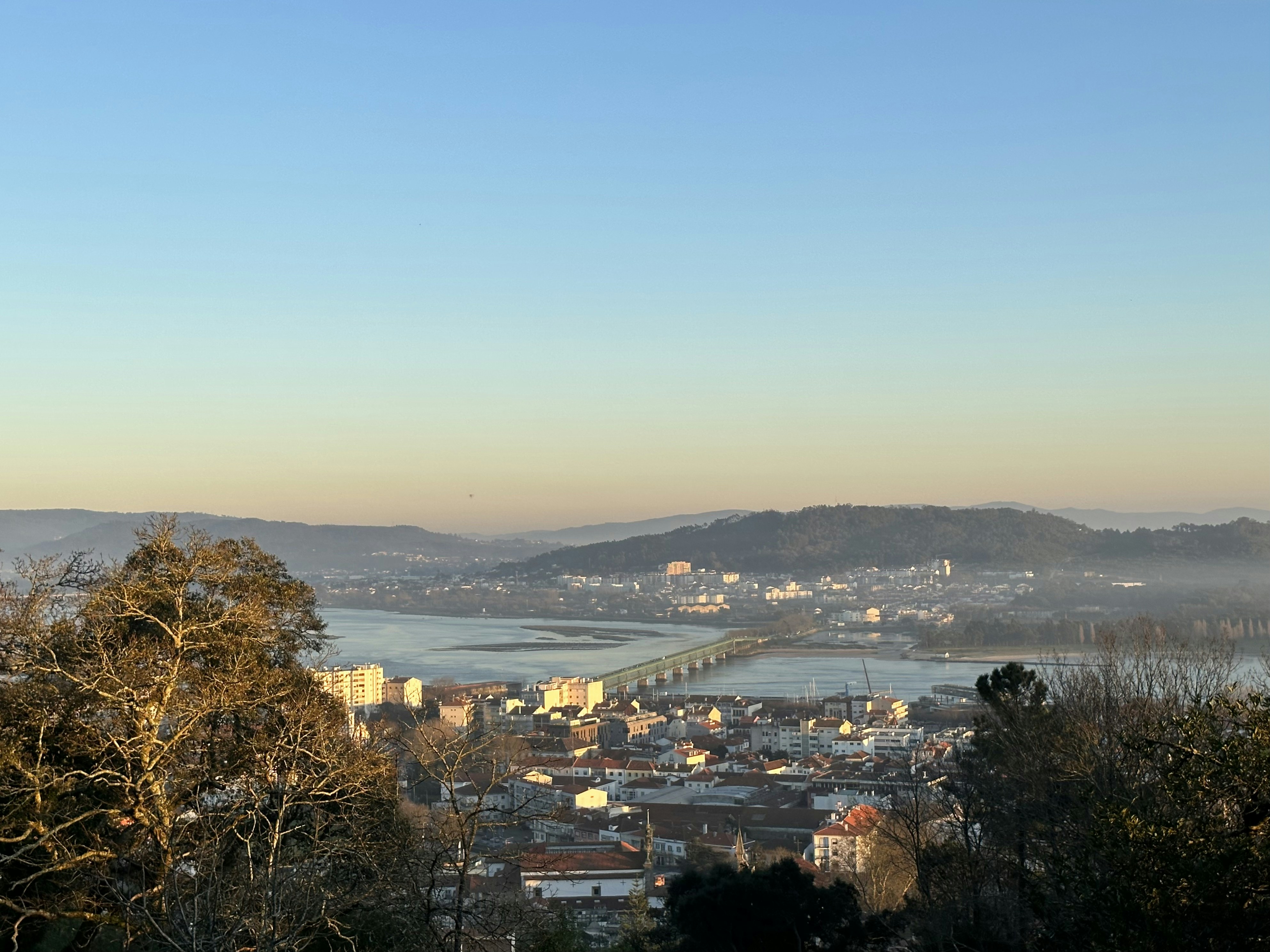Cityscape with Lima river and Ponte Eiffel Bridge at sunset, Viana do Castelo, Portugal, January 2024