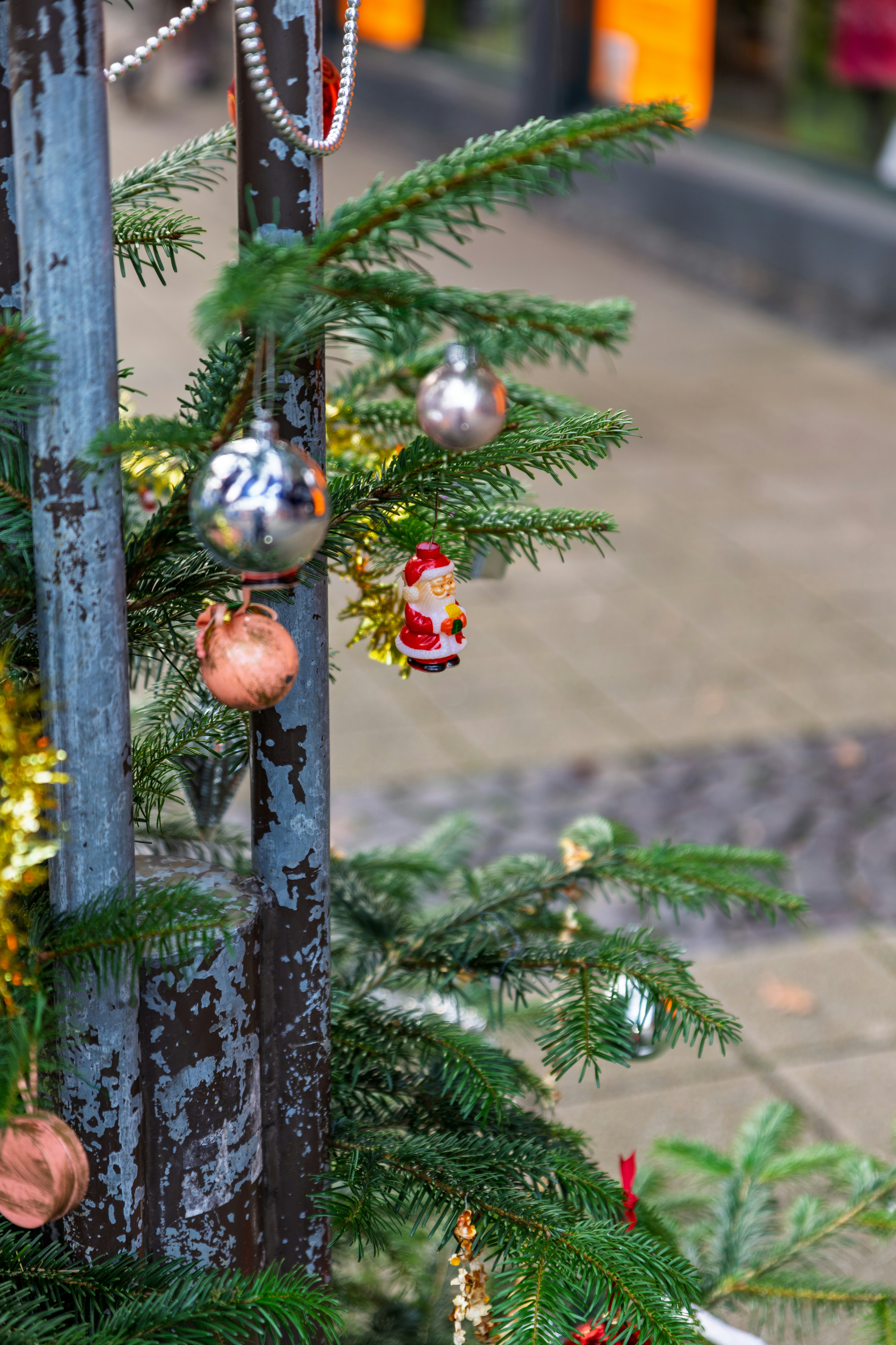 Ornament-Threaded Focal on a Weathered Rail