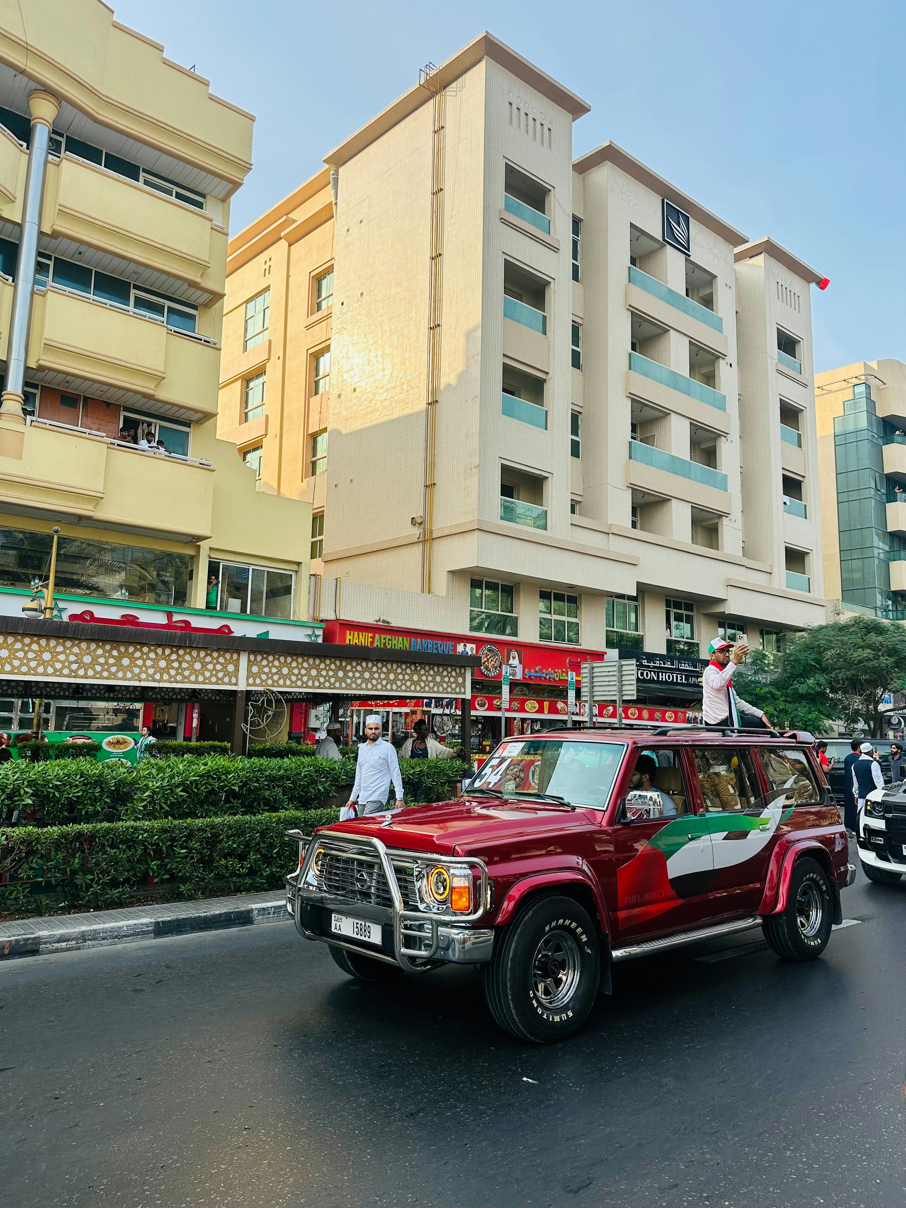 Red Classic: A Vintage Pickup Borged Through a Bustling Street