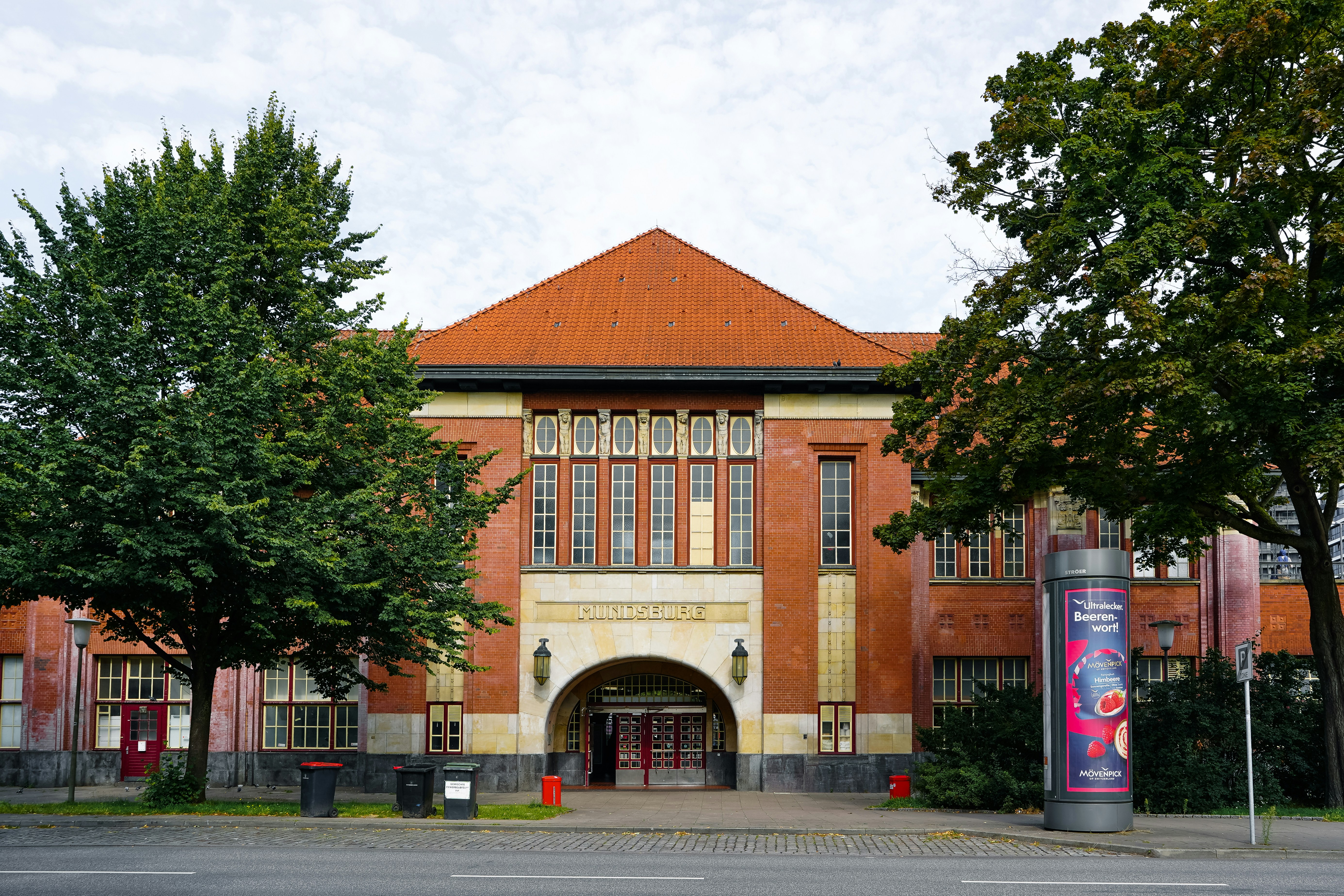 Brick Facade and Arched Entrance of a City Campus Building