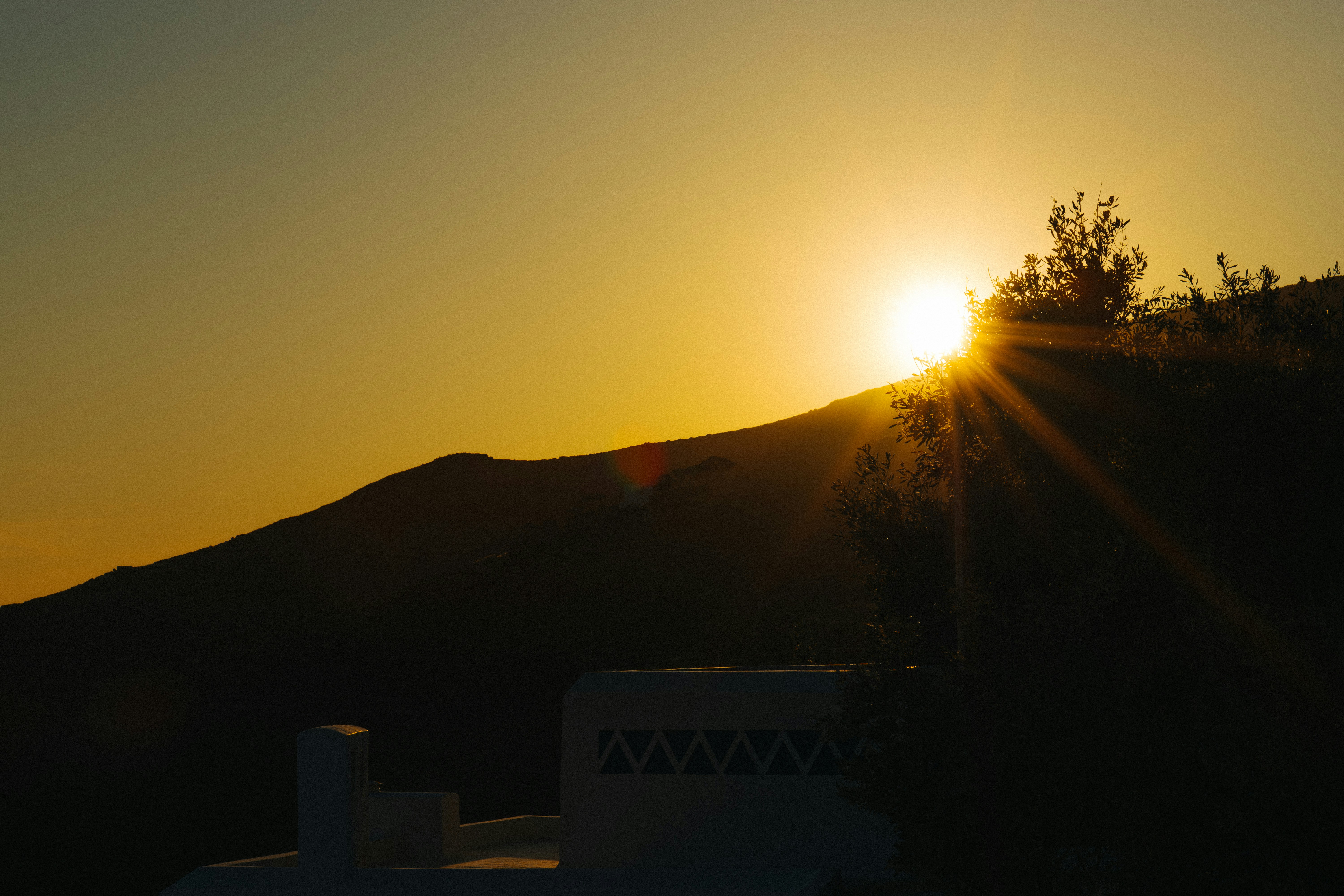 Sunlit Summit: A Quiet Dusk Over the Hill