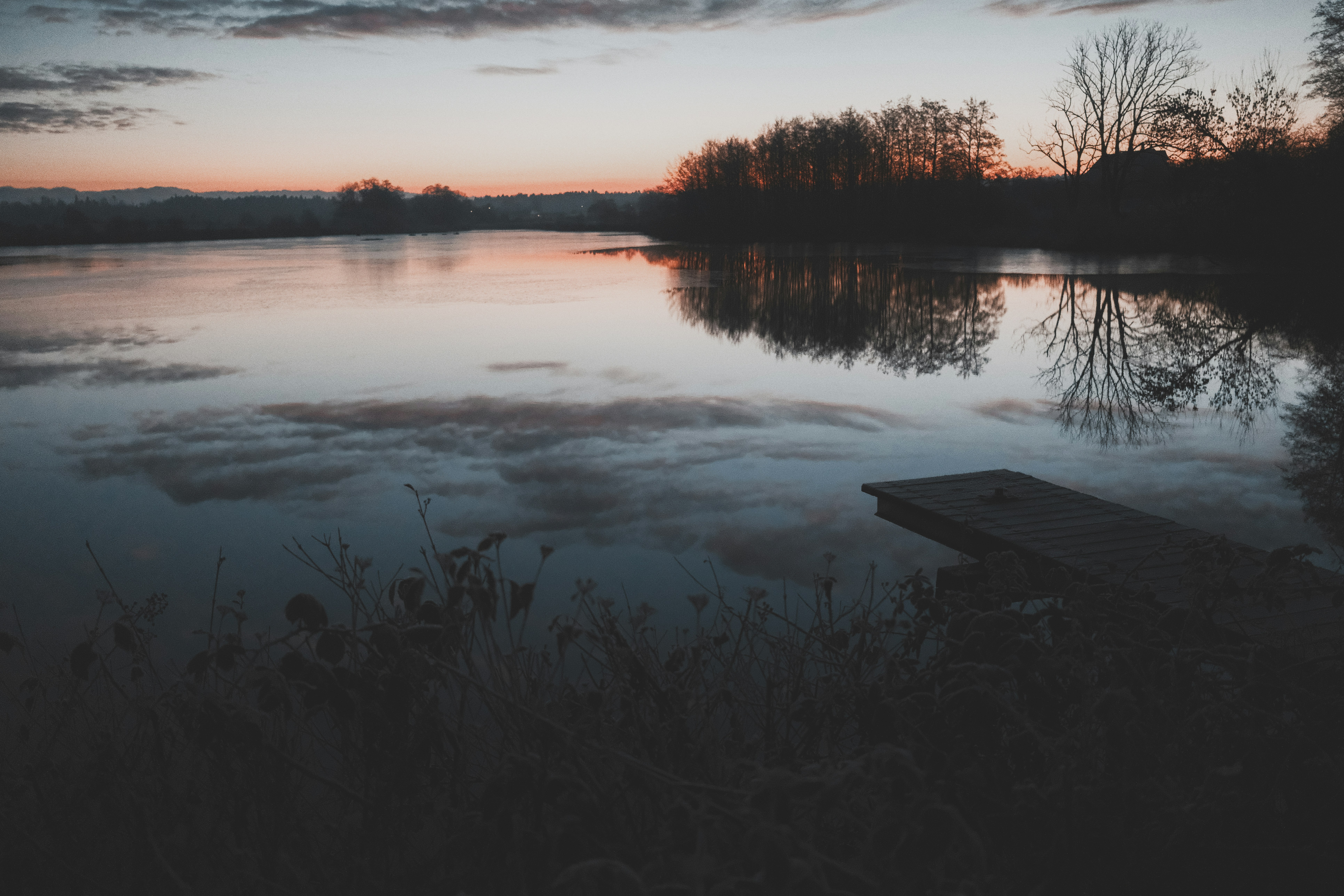 Dawn on a Quiet Lake: reflections and a lone dock