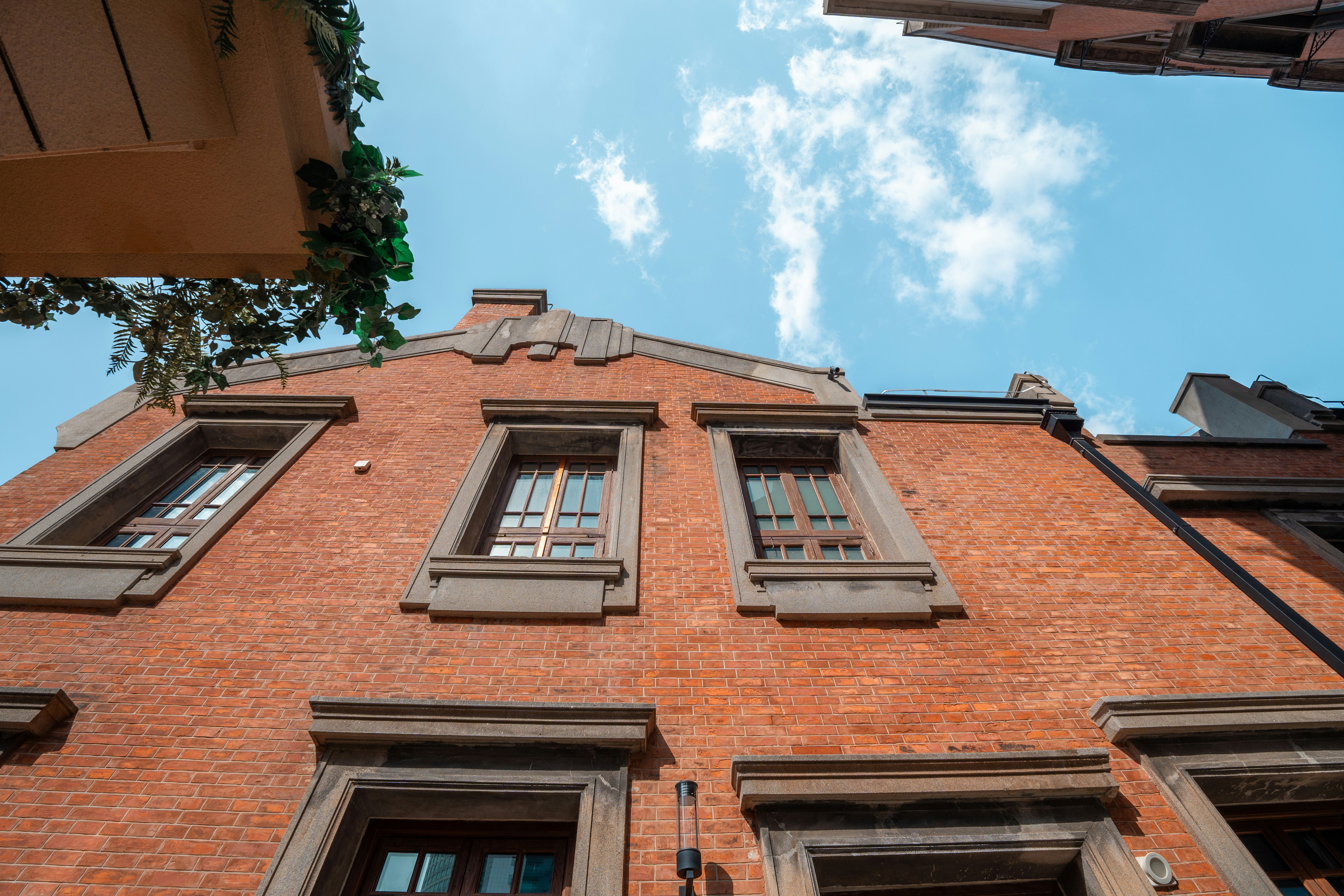 Red brick building with windows under blue sky photo – Free Old ...