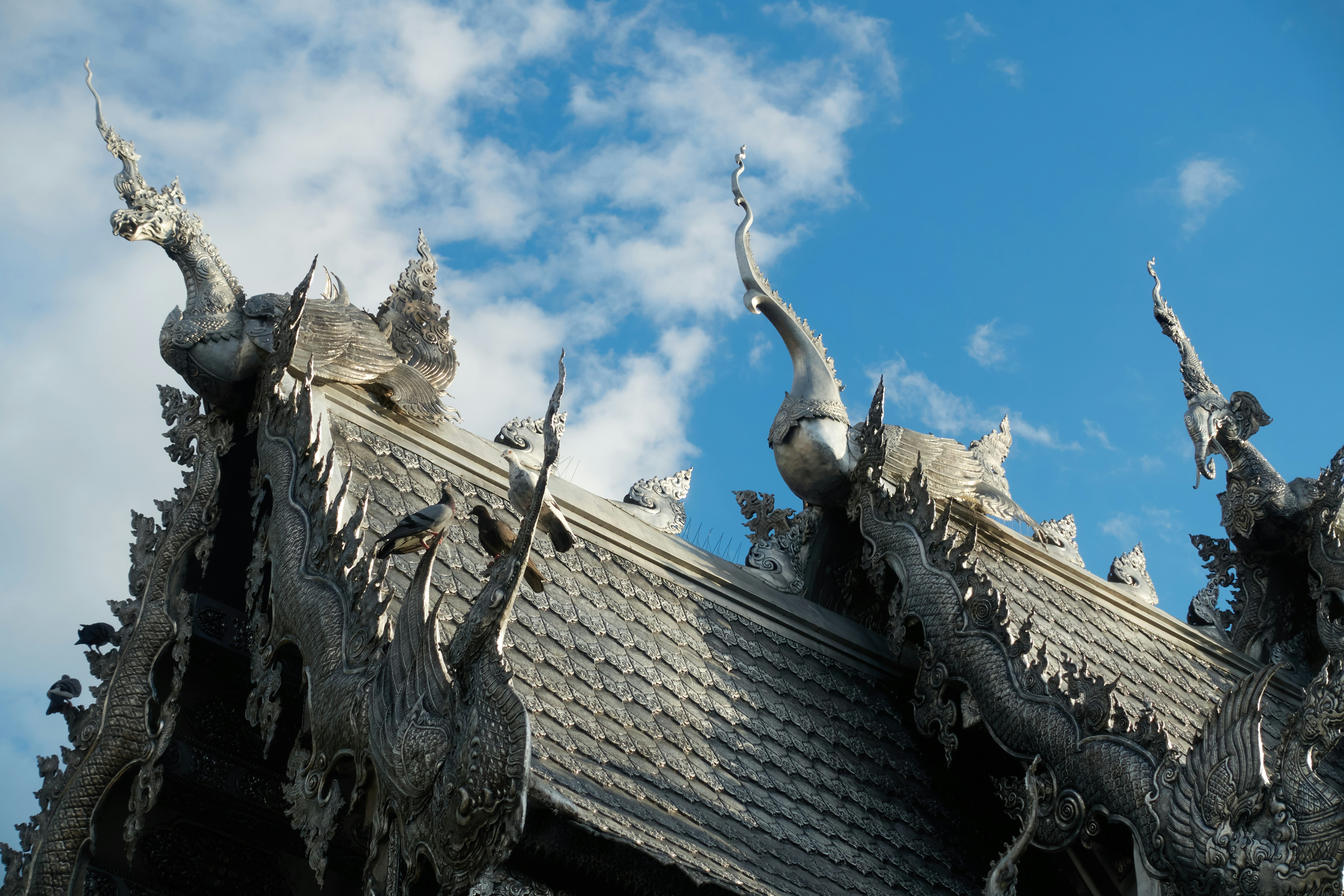 Dragon-ornamented Roof Silhouettes Against a Clear Sky