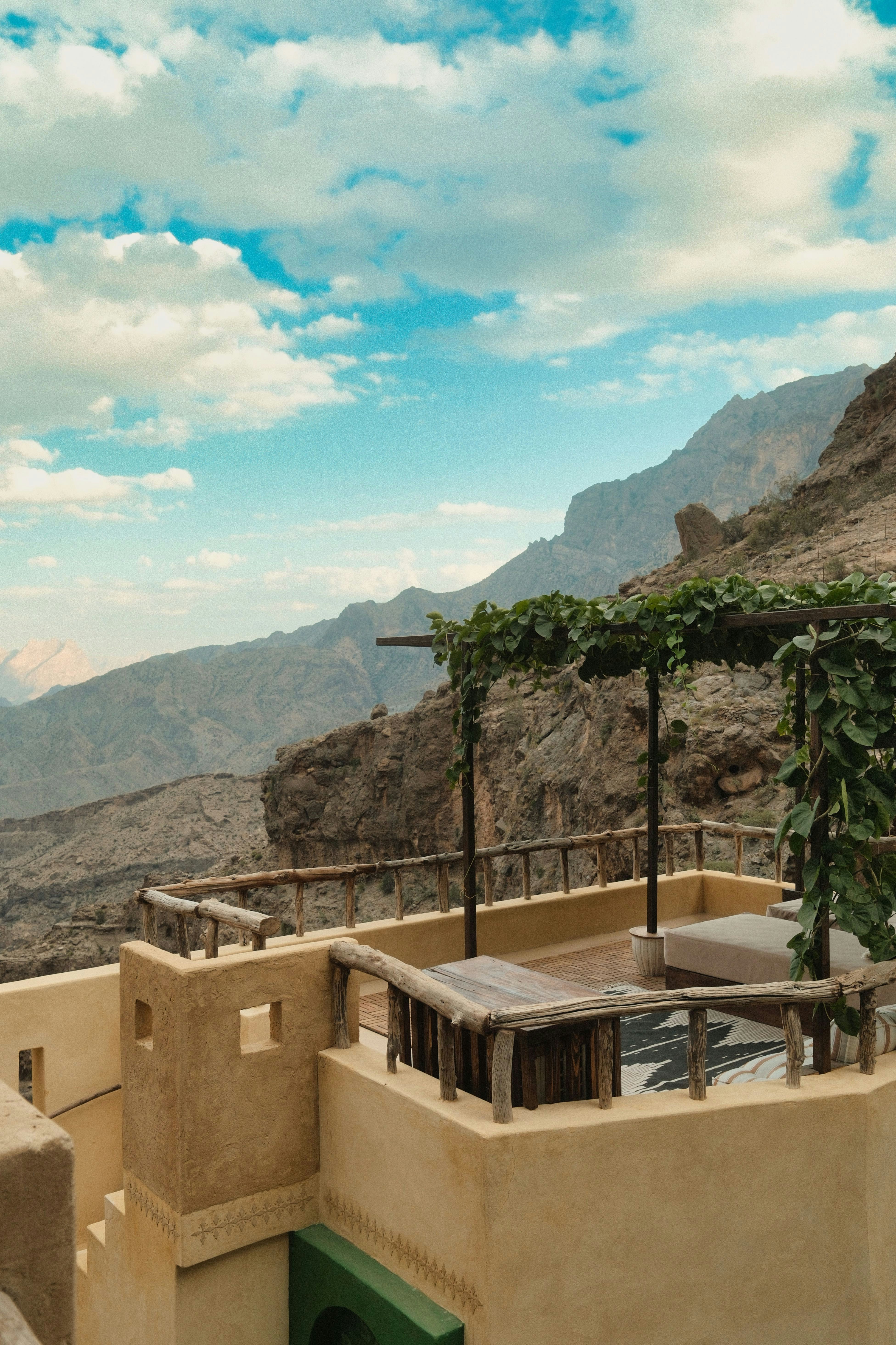Terrace Overlook: Desert Rockscape Framed by Green Canopy