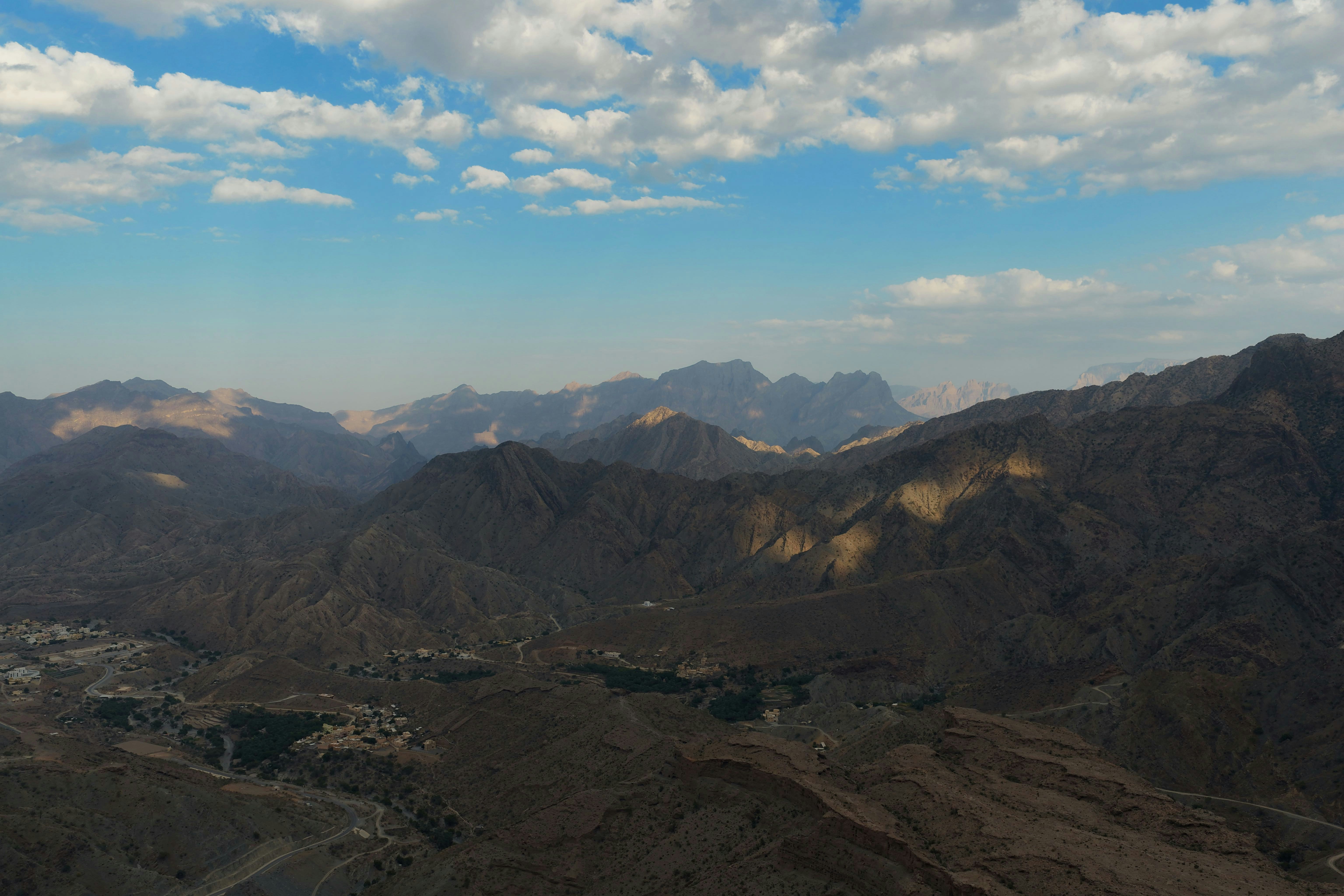 Skyline Between Desert Valleys: A Distant Range Embraced by Open Skies