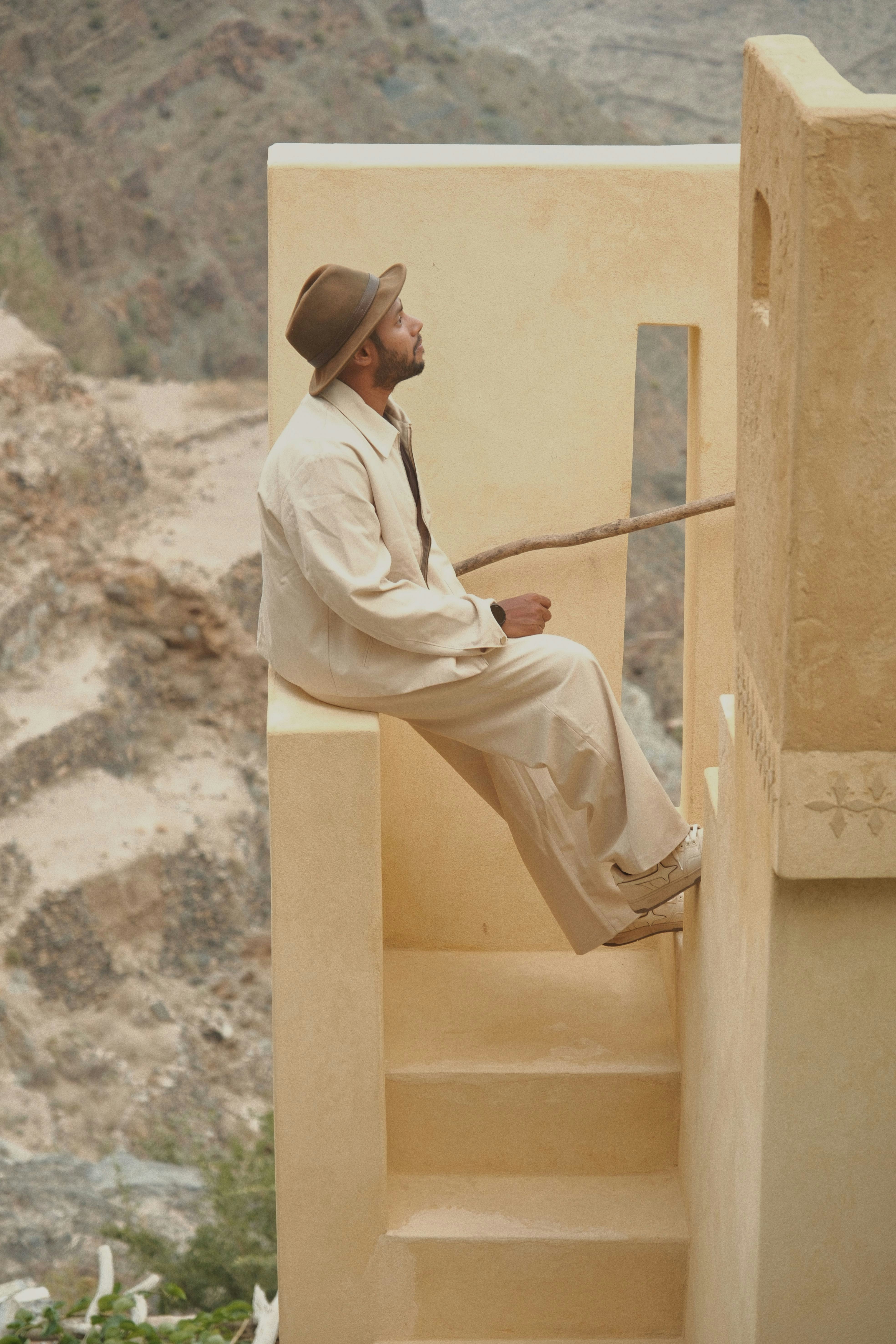 Desert Balcony Traveler: A Quiet Moment on Sunlit Steps