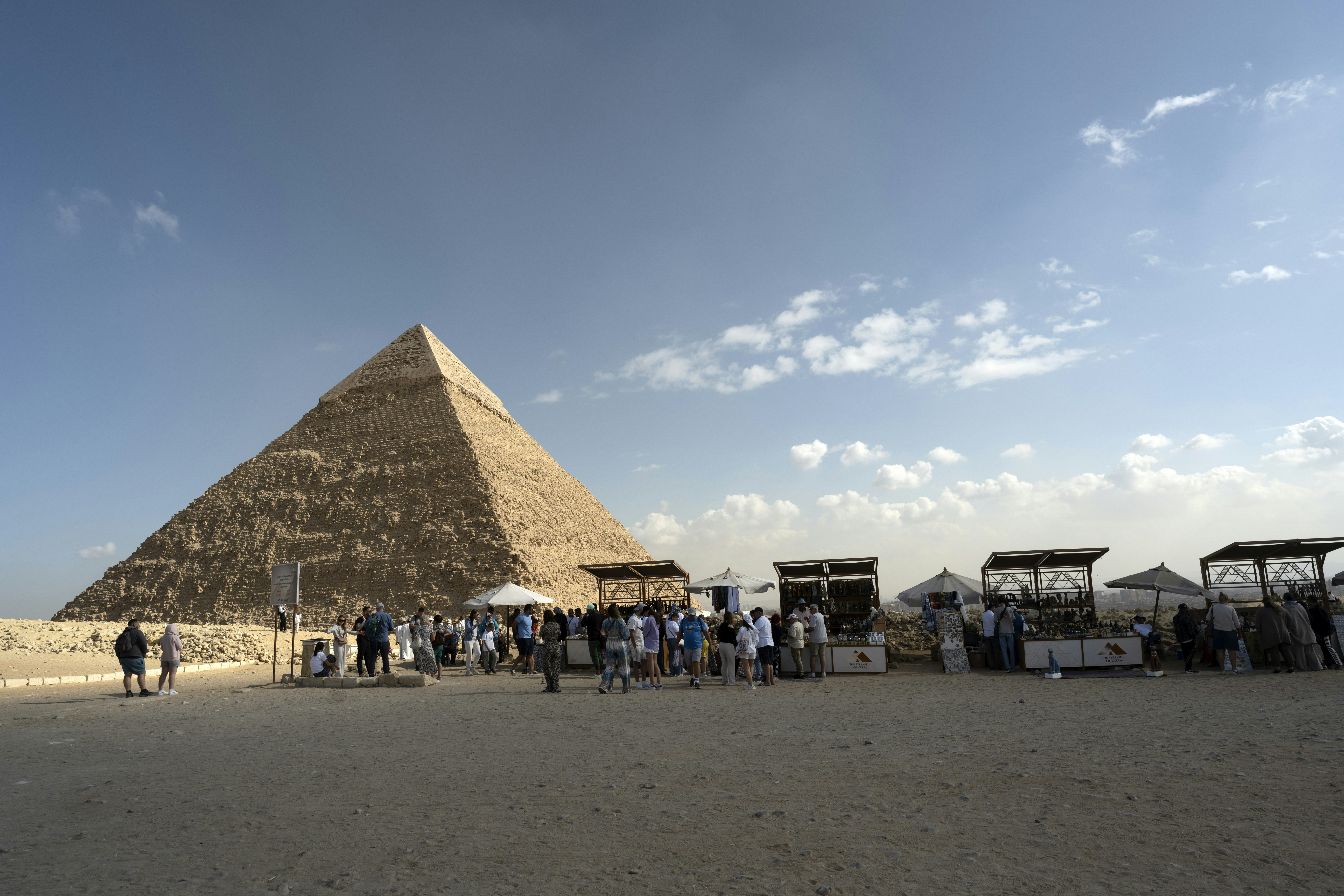 Sunlit Pyramid Plaza: Visitors Gather at the Giza Complex