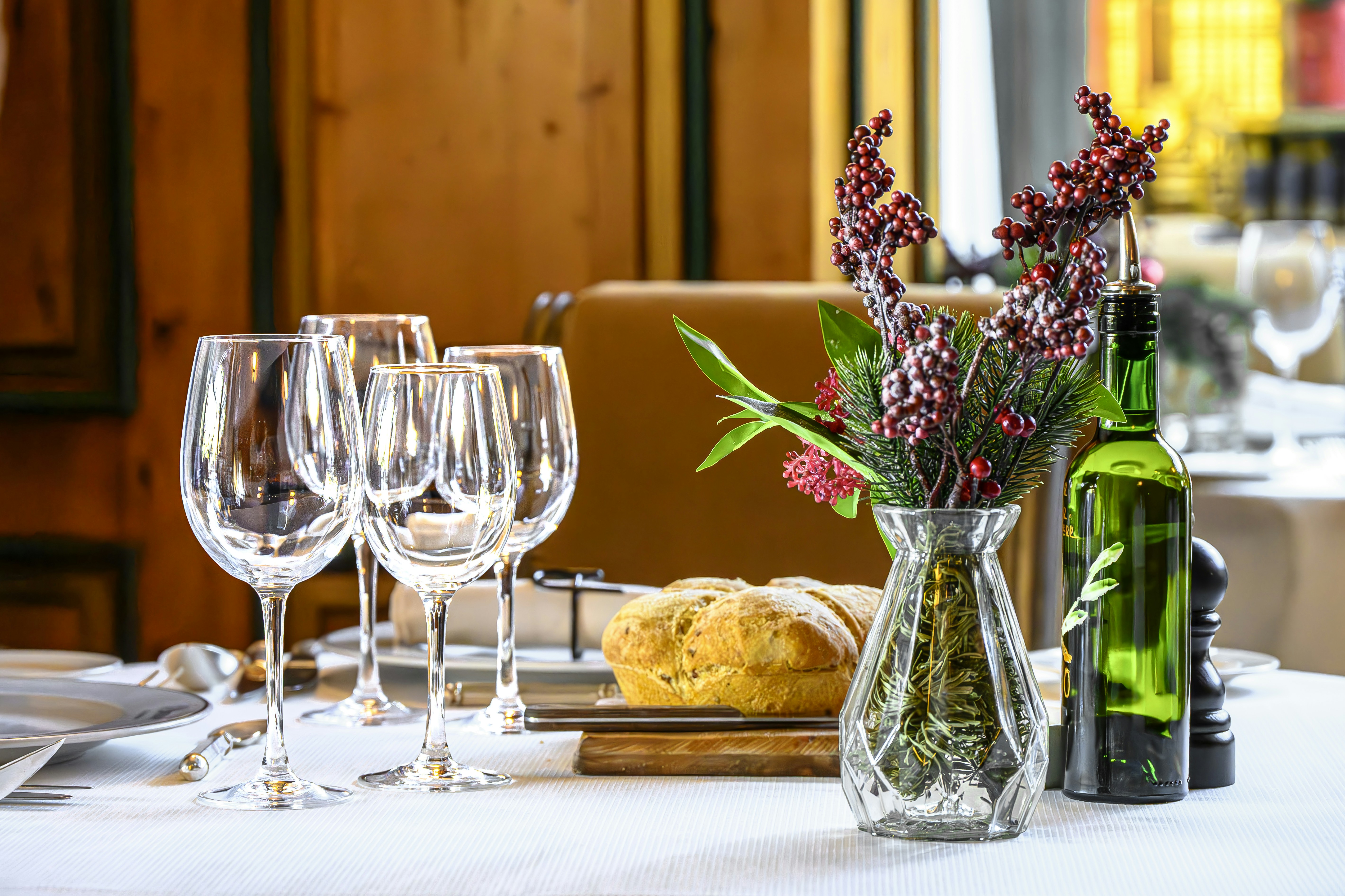 Wine, White Tablecloth, and Warm Light: A Silhouette of a Quiet Bistro