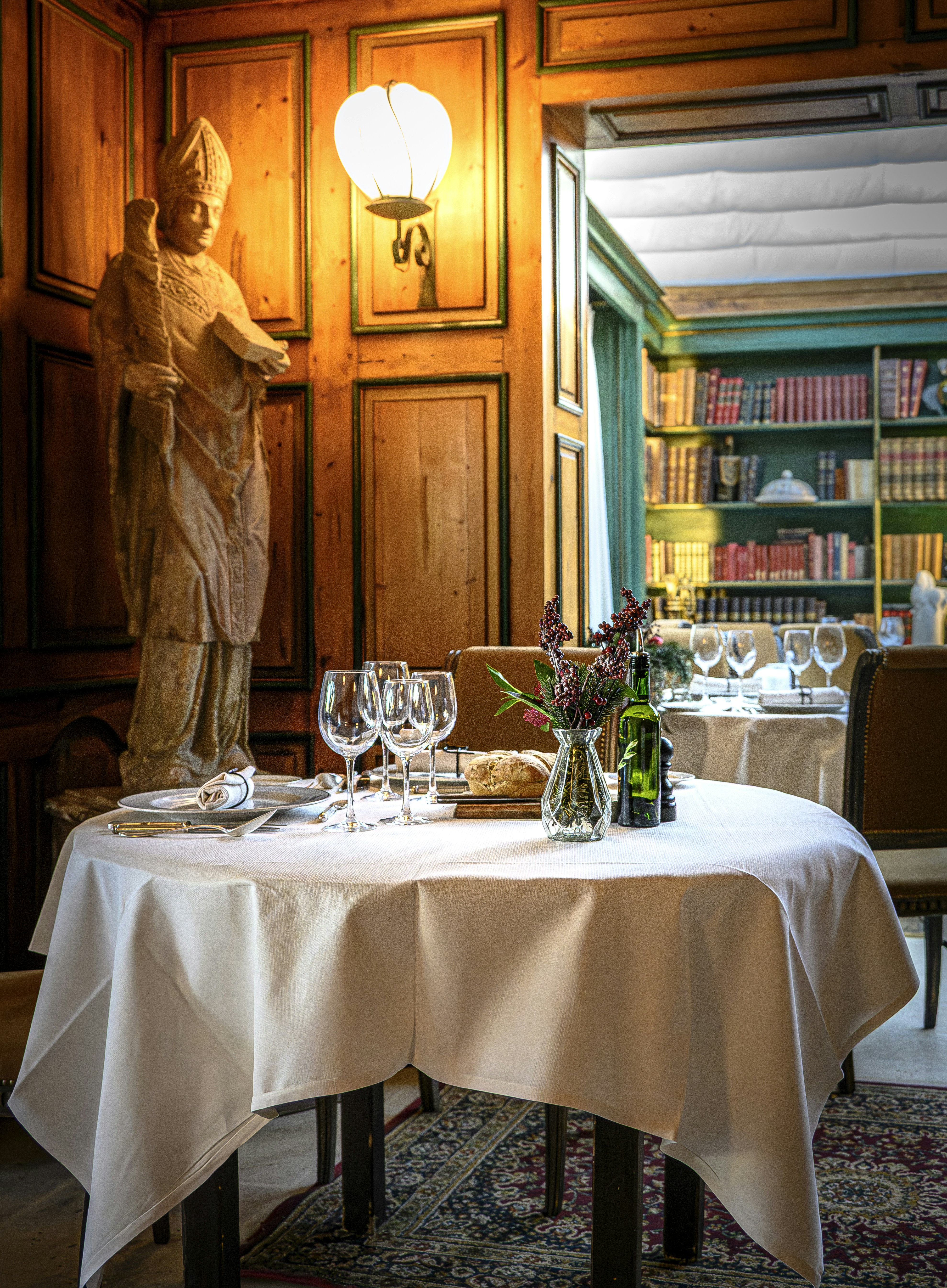 Elegance at Evening: A Quiet Table Amid Library Walls