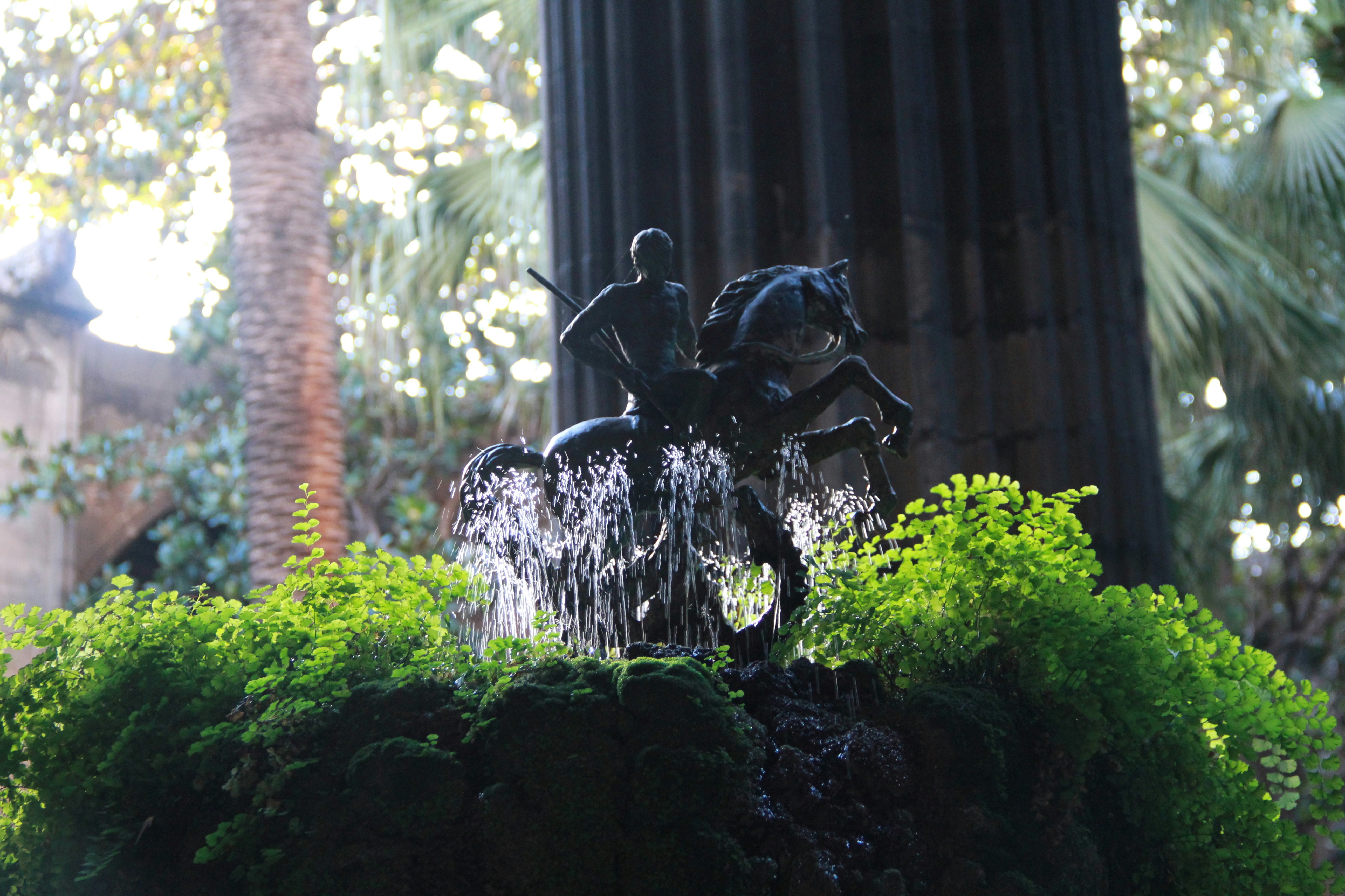 Liquid Sculptures: A Bronze Fountain with Verdant Fronds