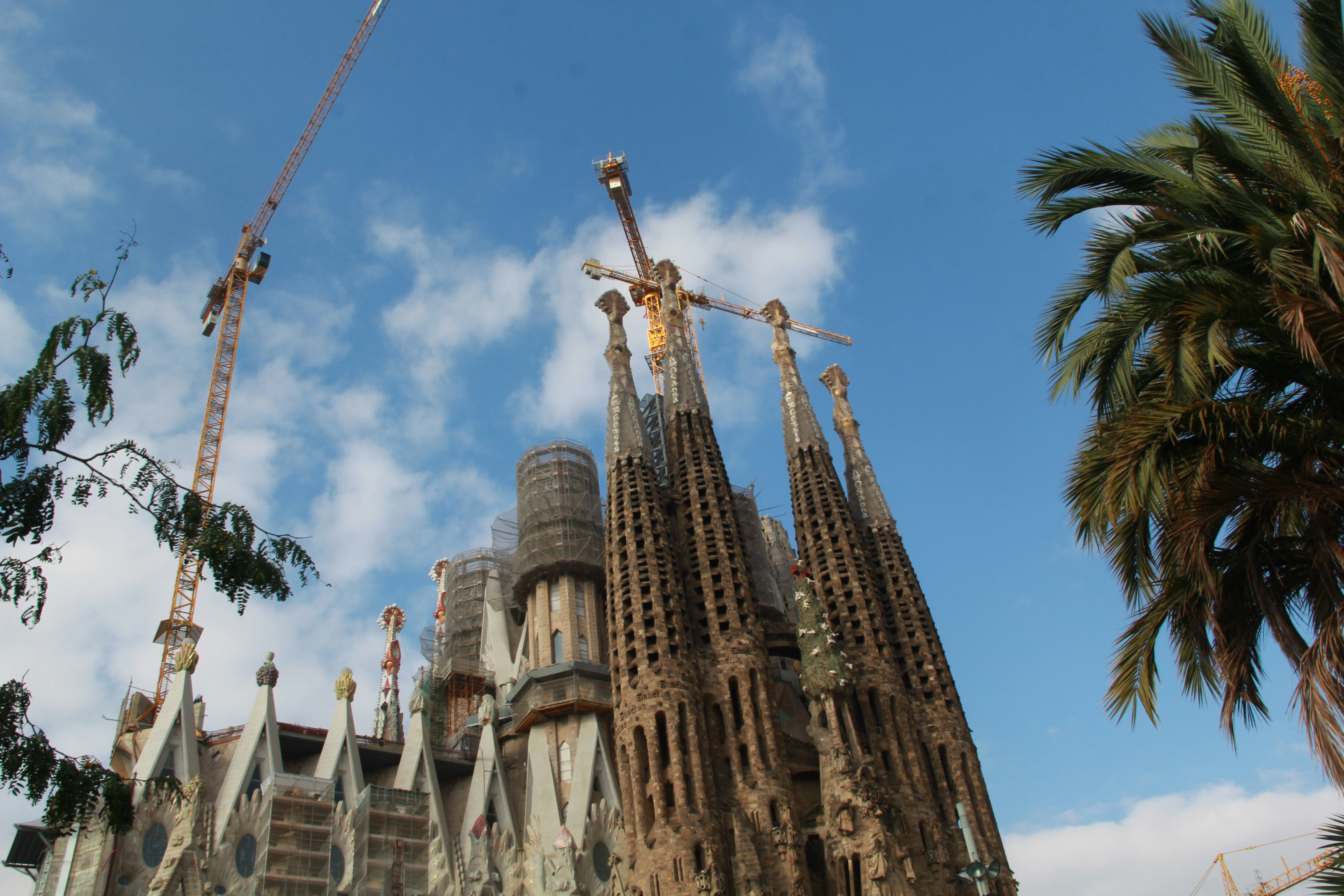 Cranes, Spires, and Sky: Construction Under a Bright Barcelona Day