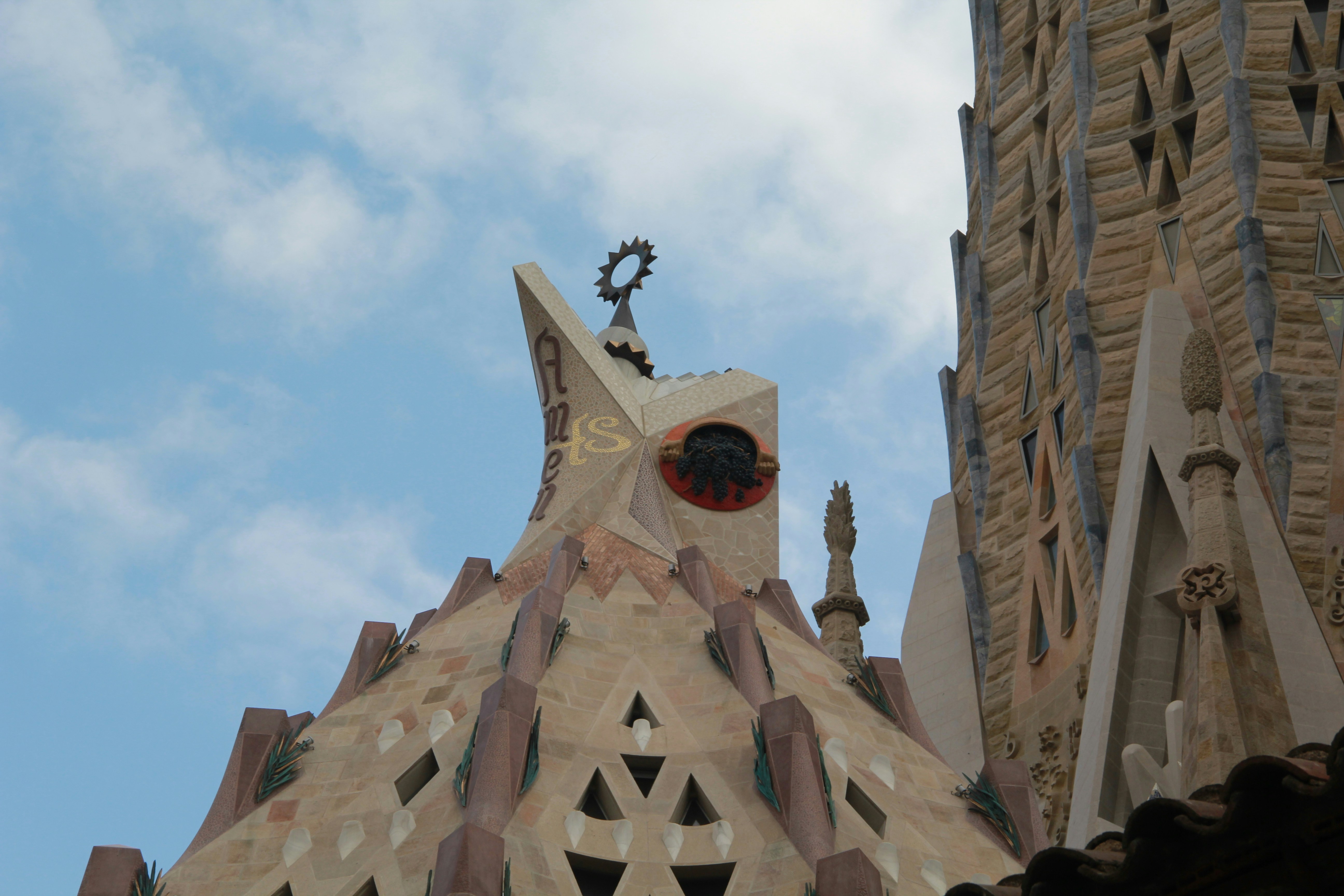 Gothic Rooftop Glyphs Under a Blue Sky