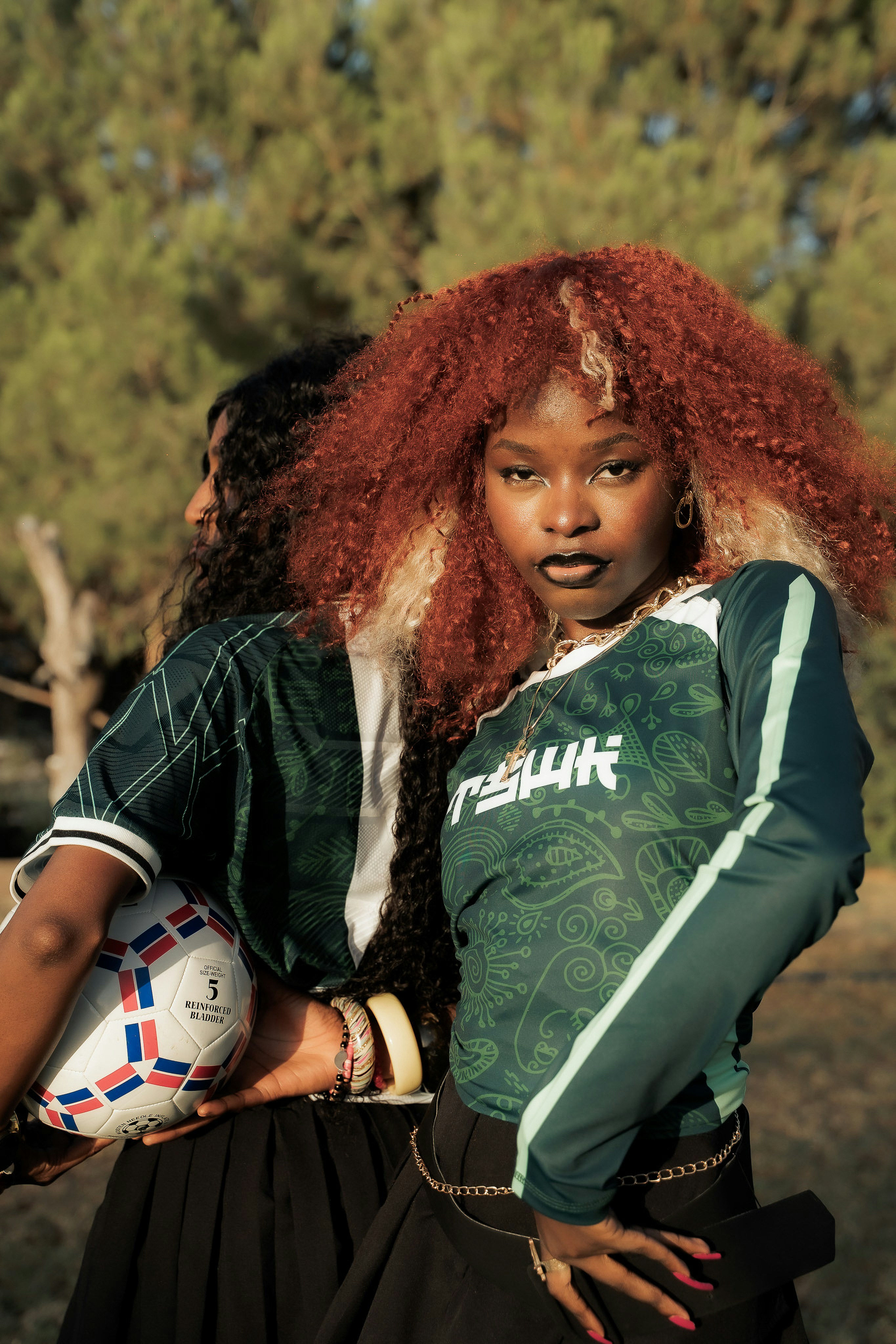 Vibrant Duo: Confidence Under Lights on a Soccer Field