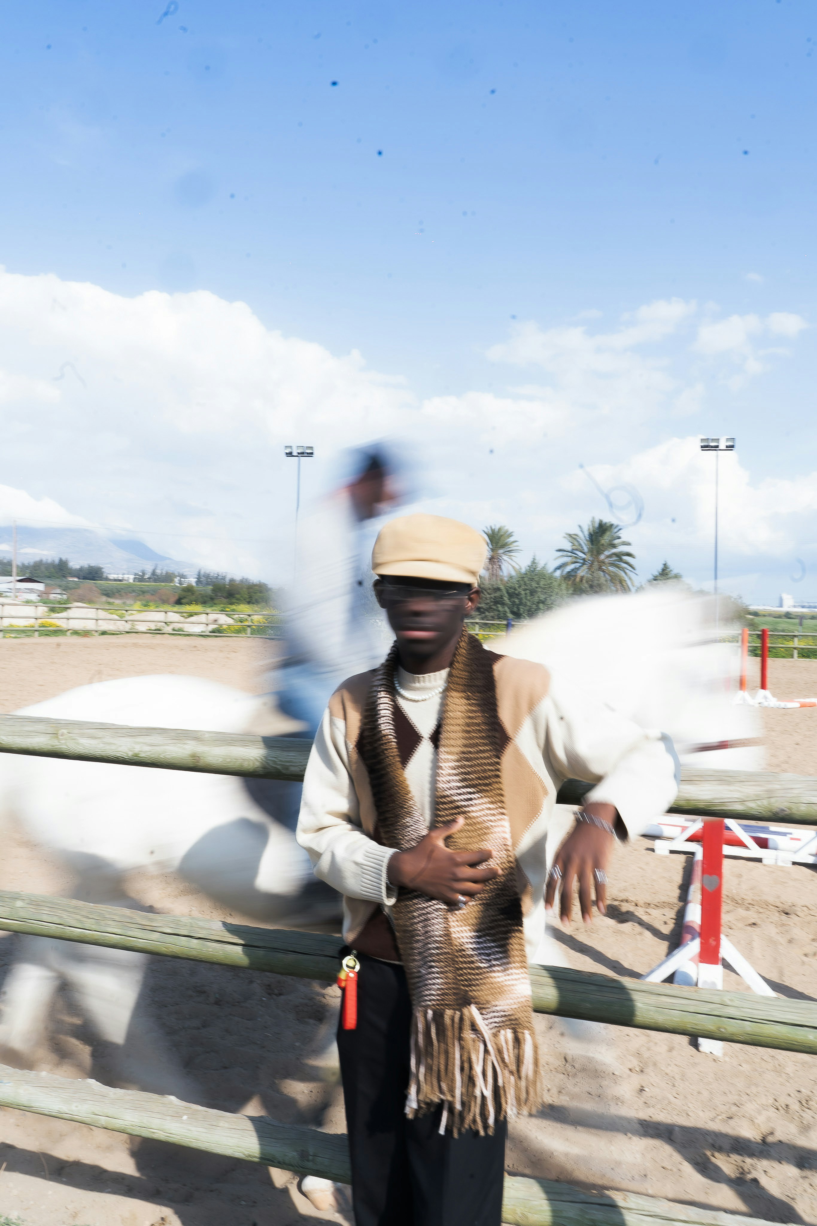 Pose at the Fence: A Casual Portrait in Motion Blur