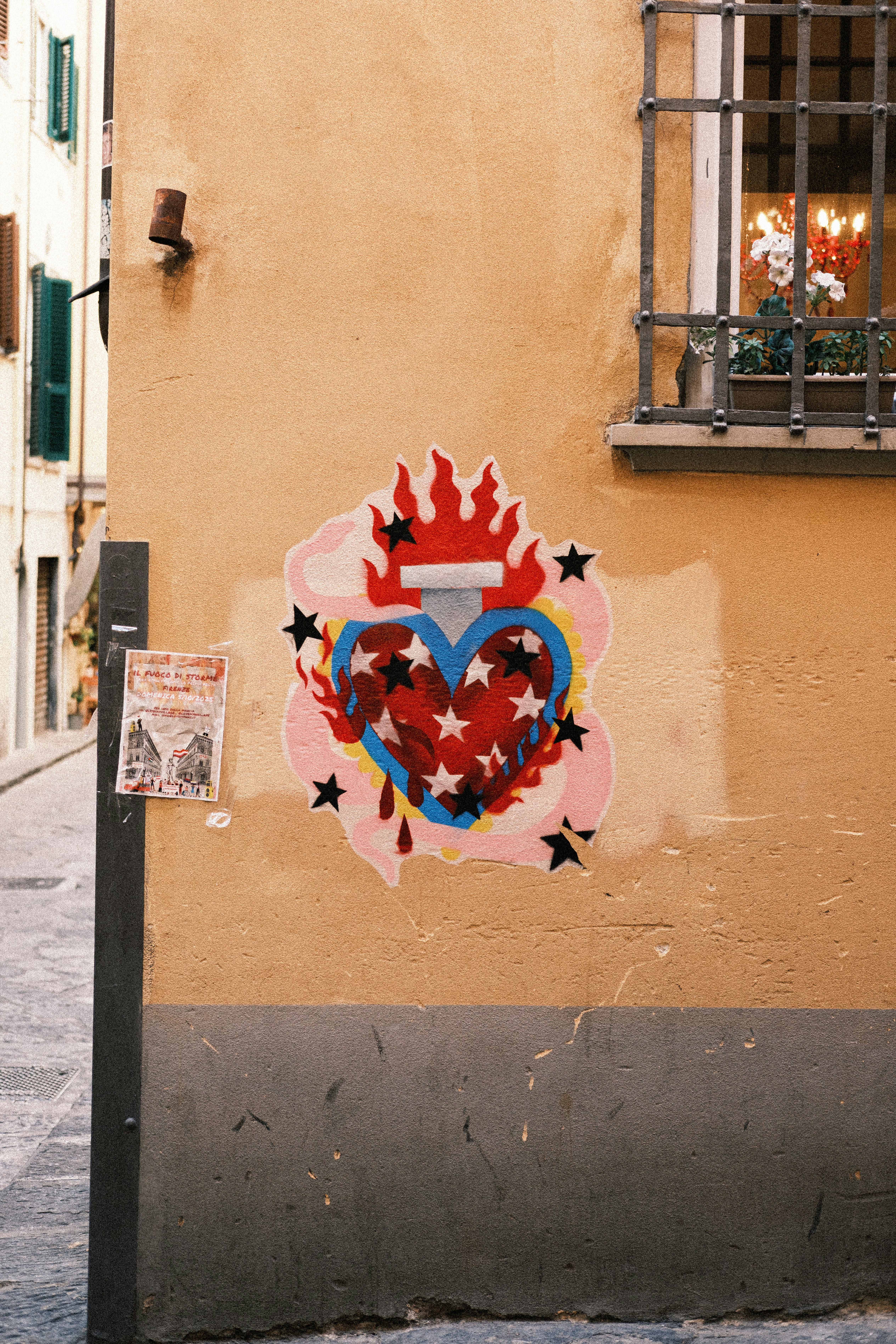 Heart of the Street: Graffiti Flame on a Warm Plaster Wall