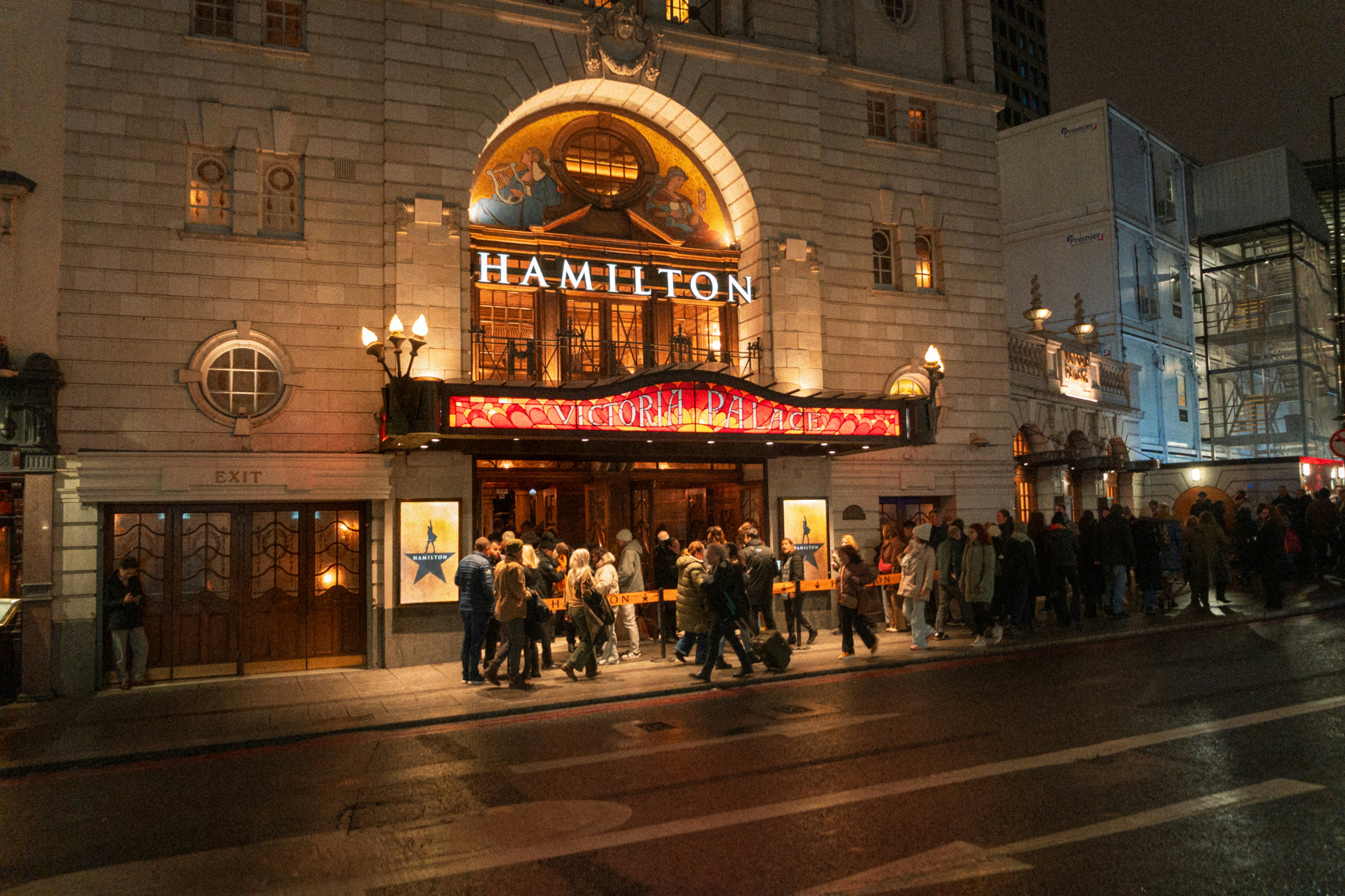 Night Crowd at Hamilton Theatre: Neon Marquee and Historic Facade