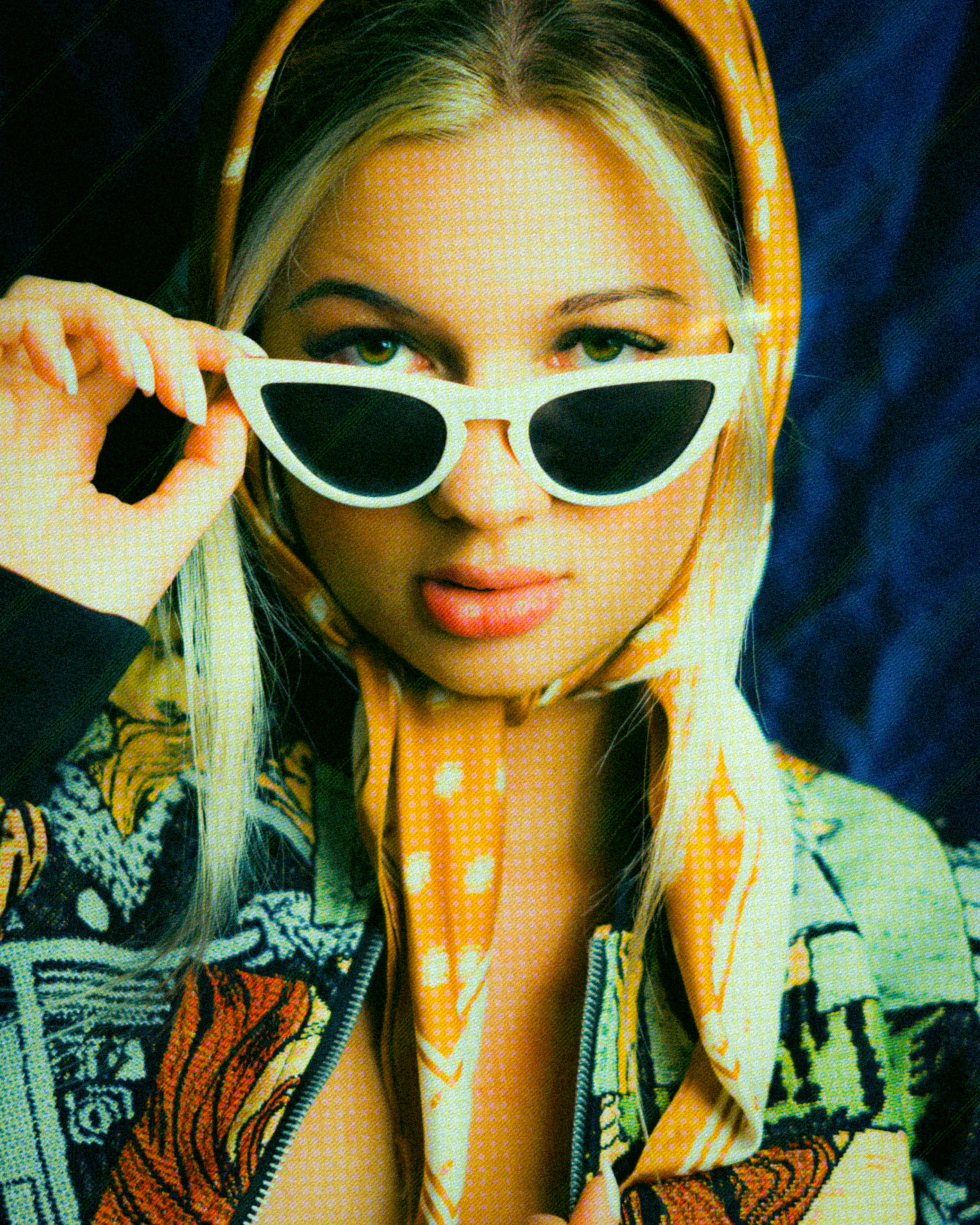 Bold Eyes, Bold Frames: A Sunlit Gaze in a Patterned Hooded Look