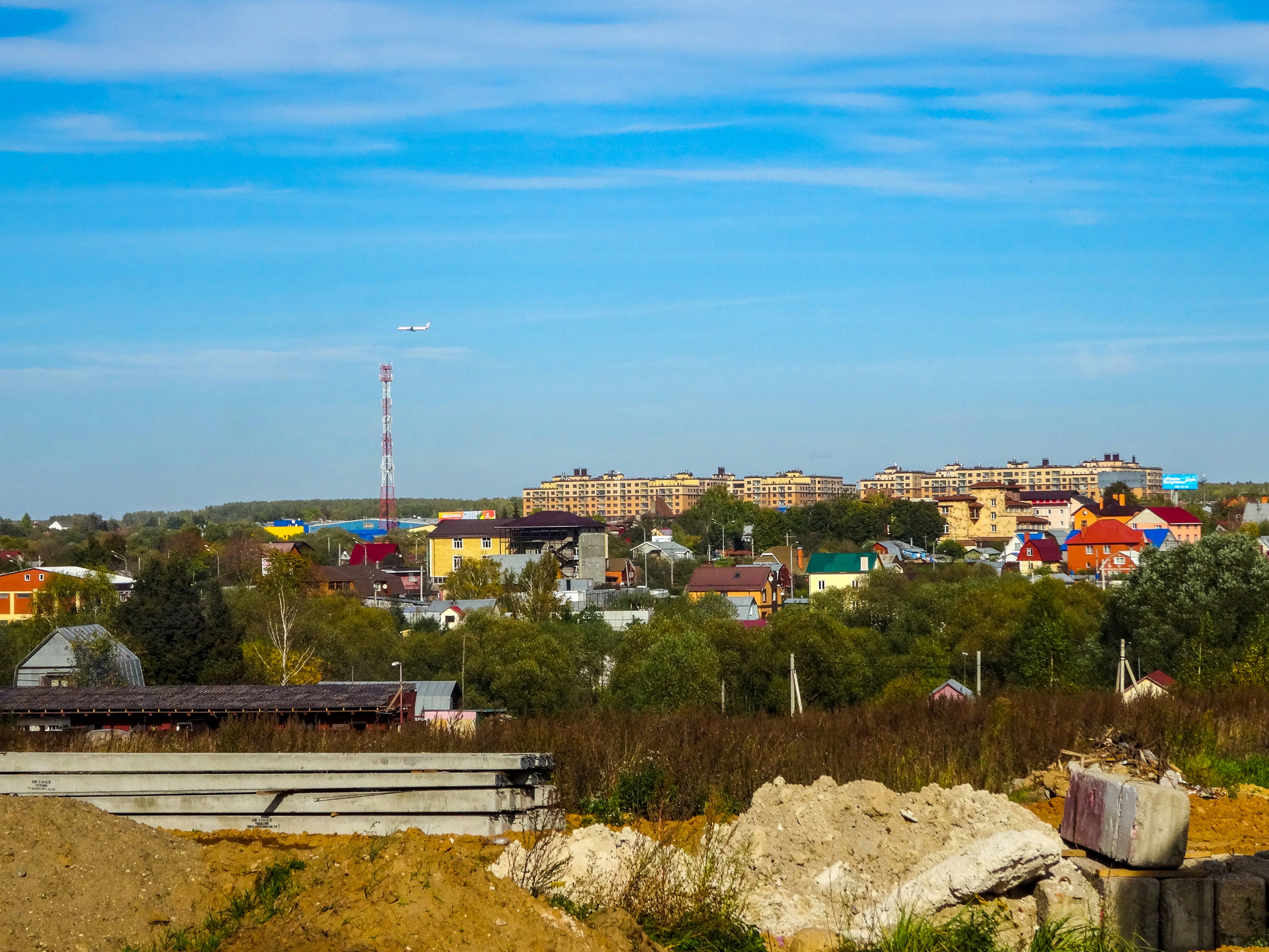 Small town with colorful houses under blue sky
