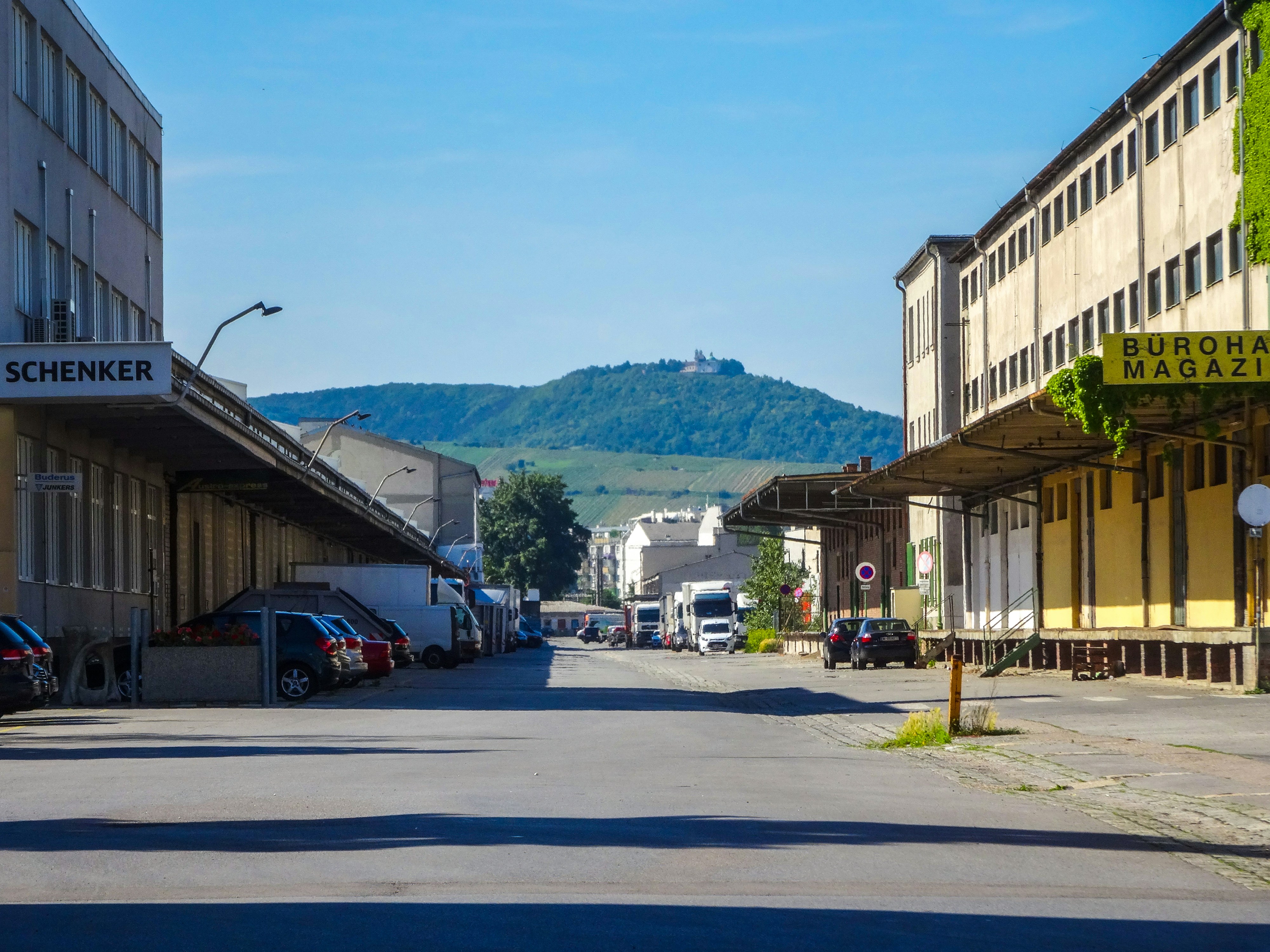 Industrial Street to the Hills: A Quiet Courtyard Corridor Between Warehouses