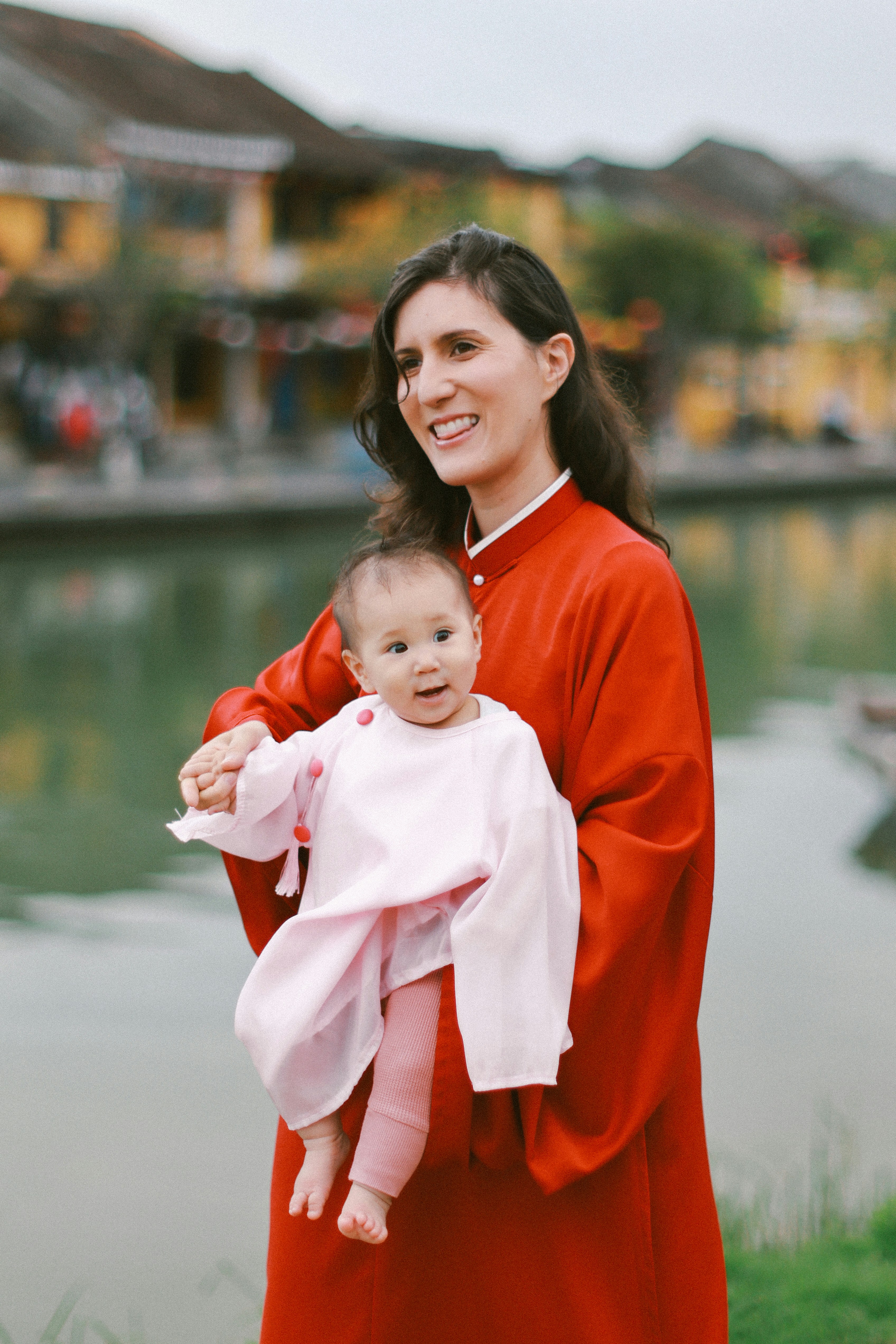 Mother and Child in a Red Robe by the Quiet Pond