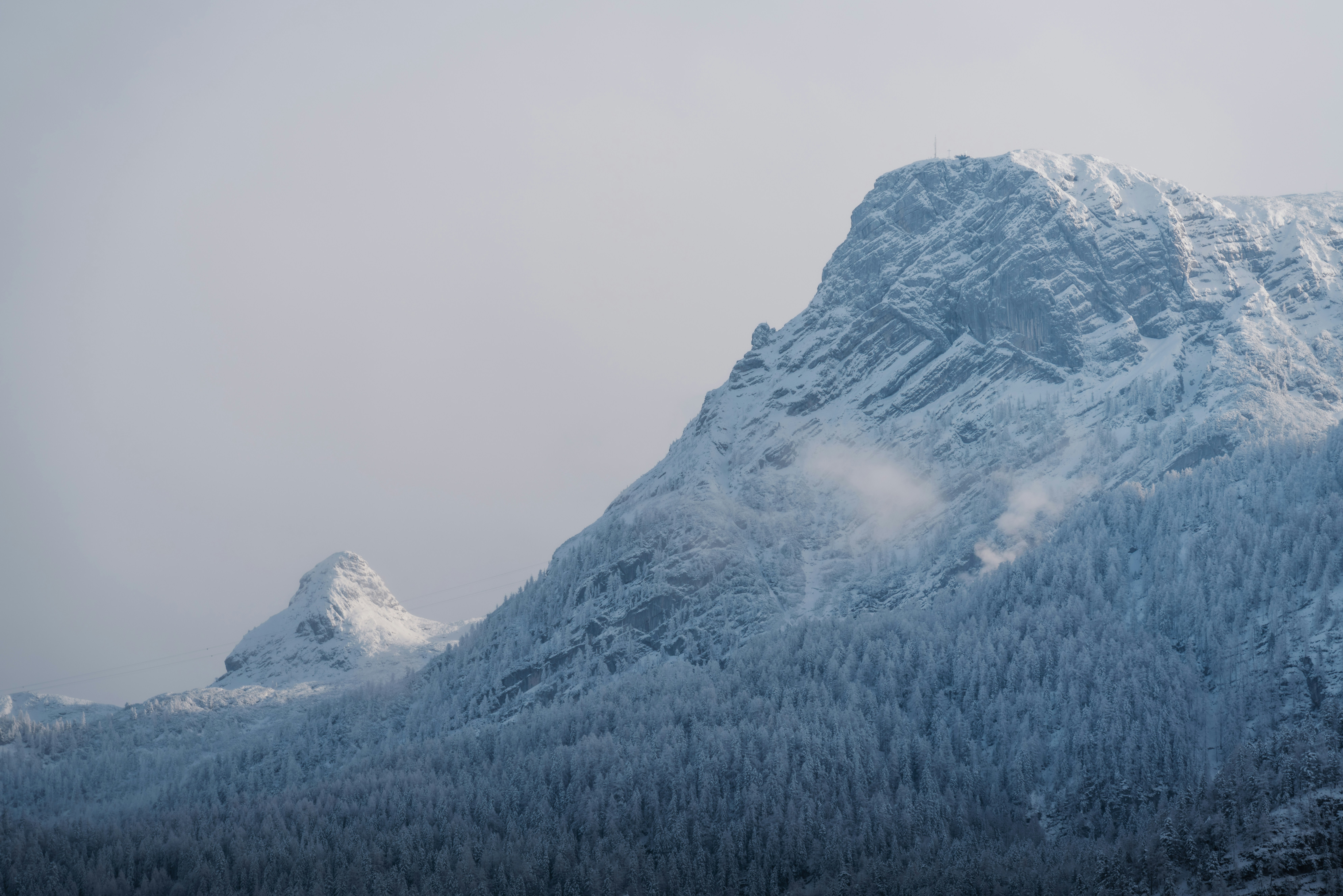 Snowbound Sentinel: A Foreground Ridge Framed by Alpine Giants