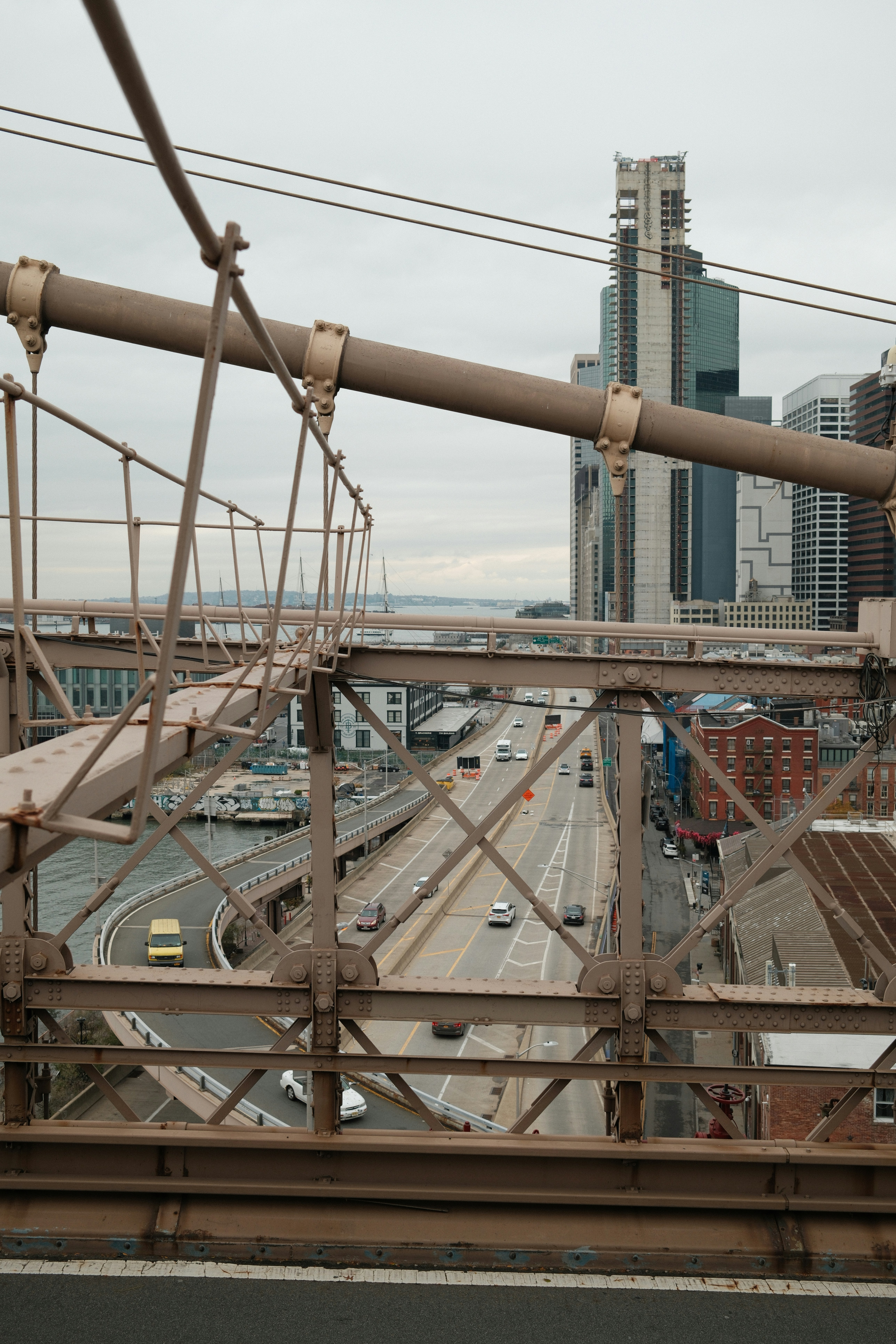 Rope and Steel: City Skyline Framed by a Bridge