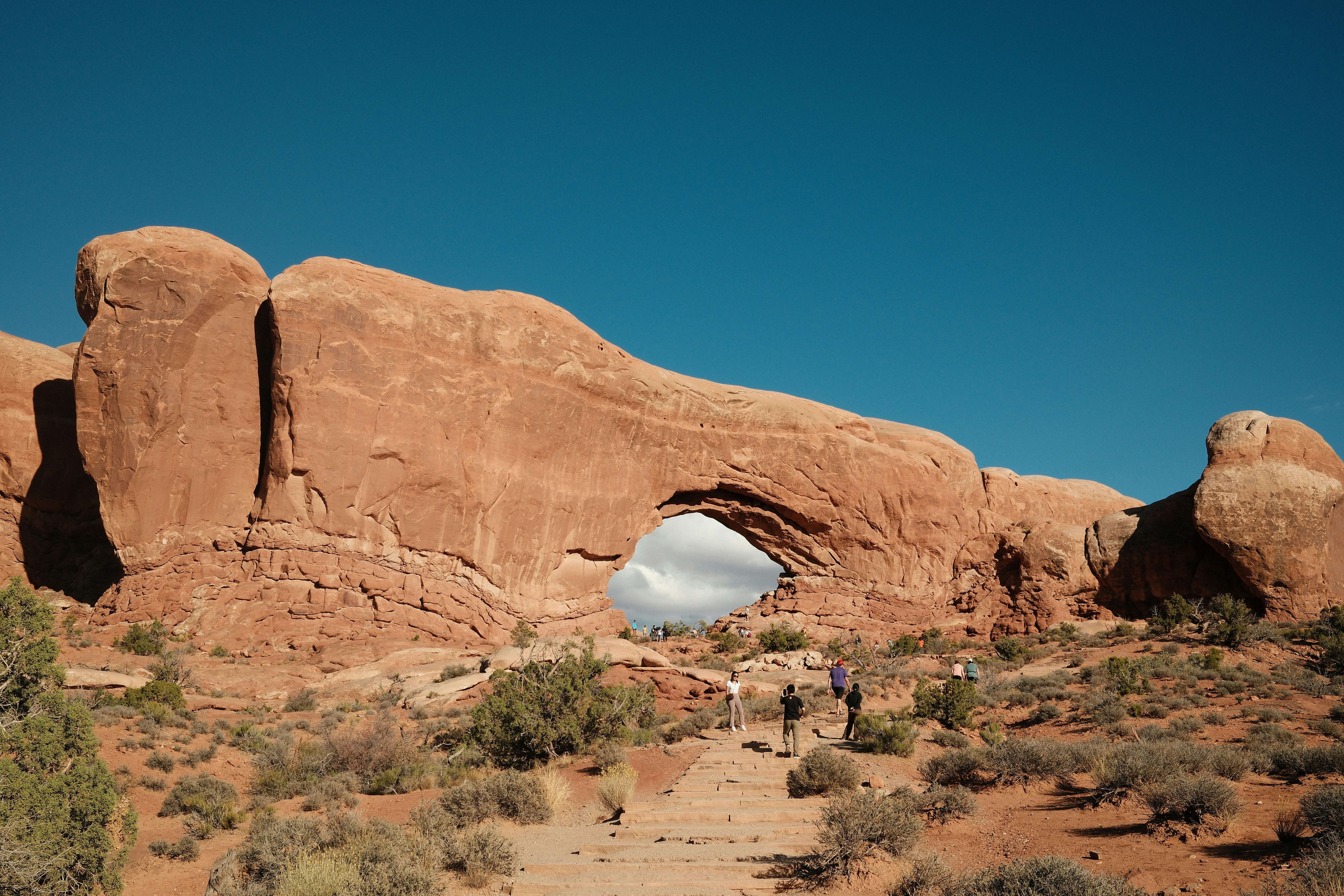 Stone Arch at Dawn: Pathway Through a Desert Arch