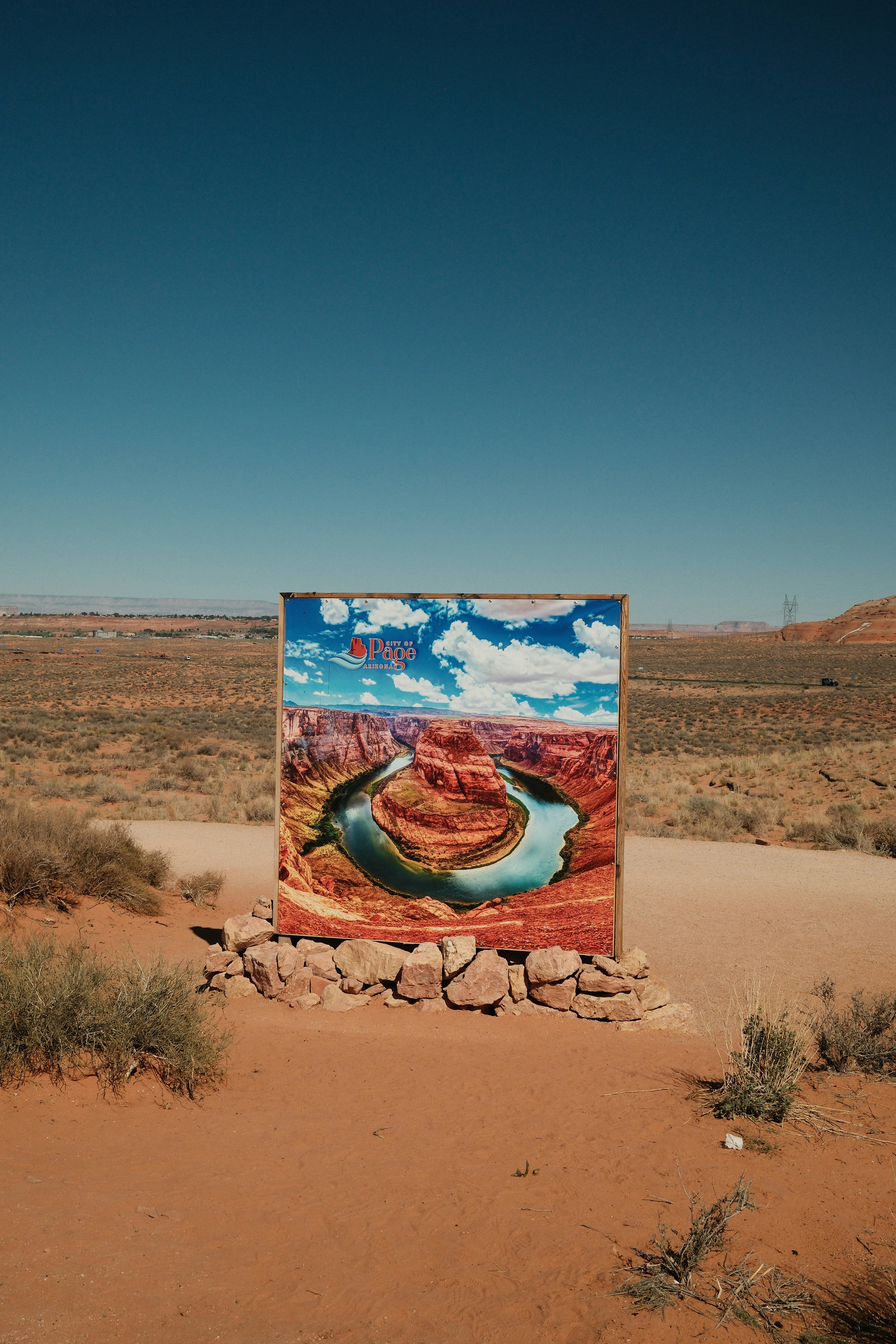 Desert Billboard Beside the Canyon: A Painted Mirror Amid Arid Vastness