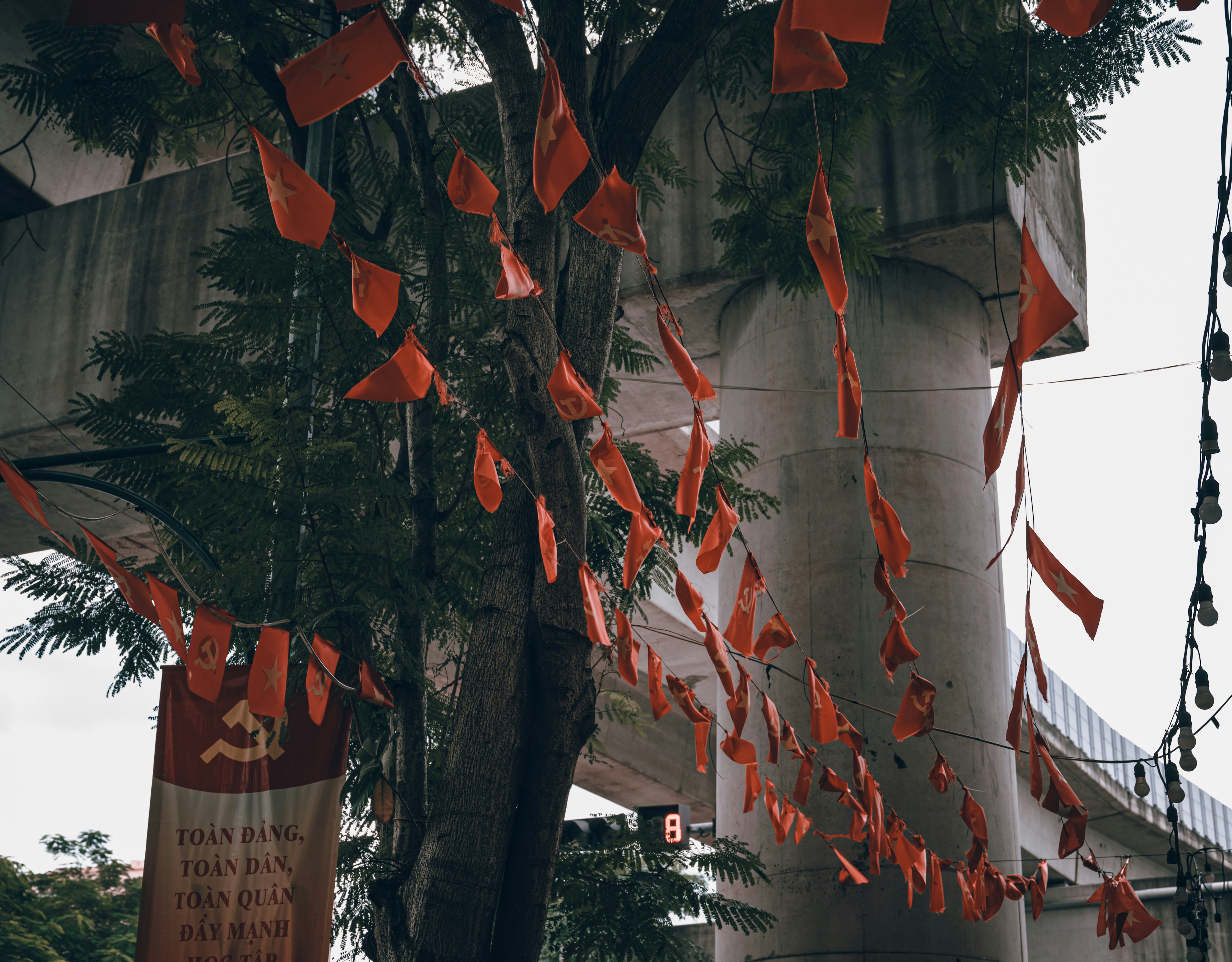 Tangled Red Promises: Flags and Concrete Arcades