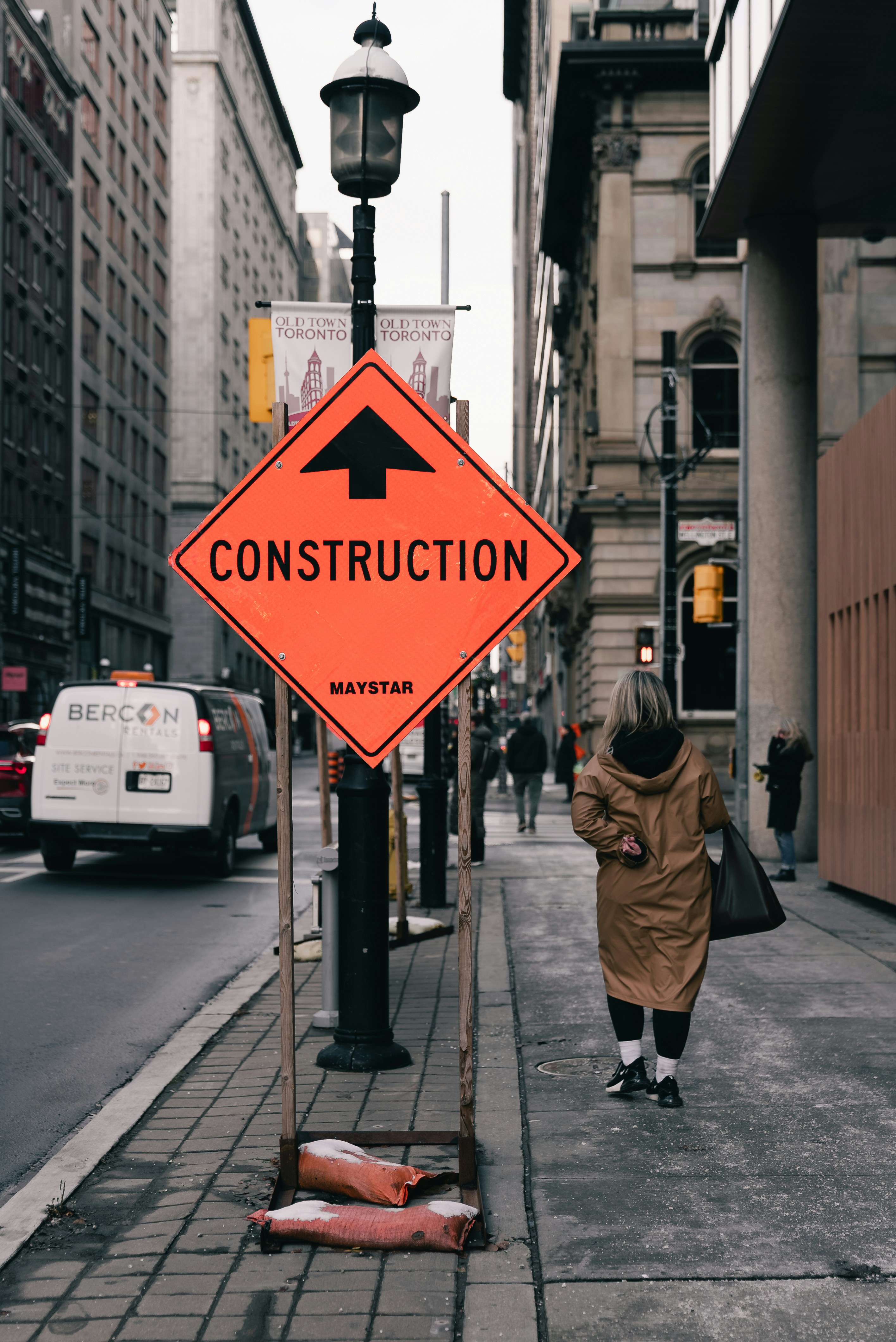 Orange construction sign on a city sidewalk photo – Free Infrastructure ...